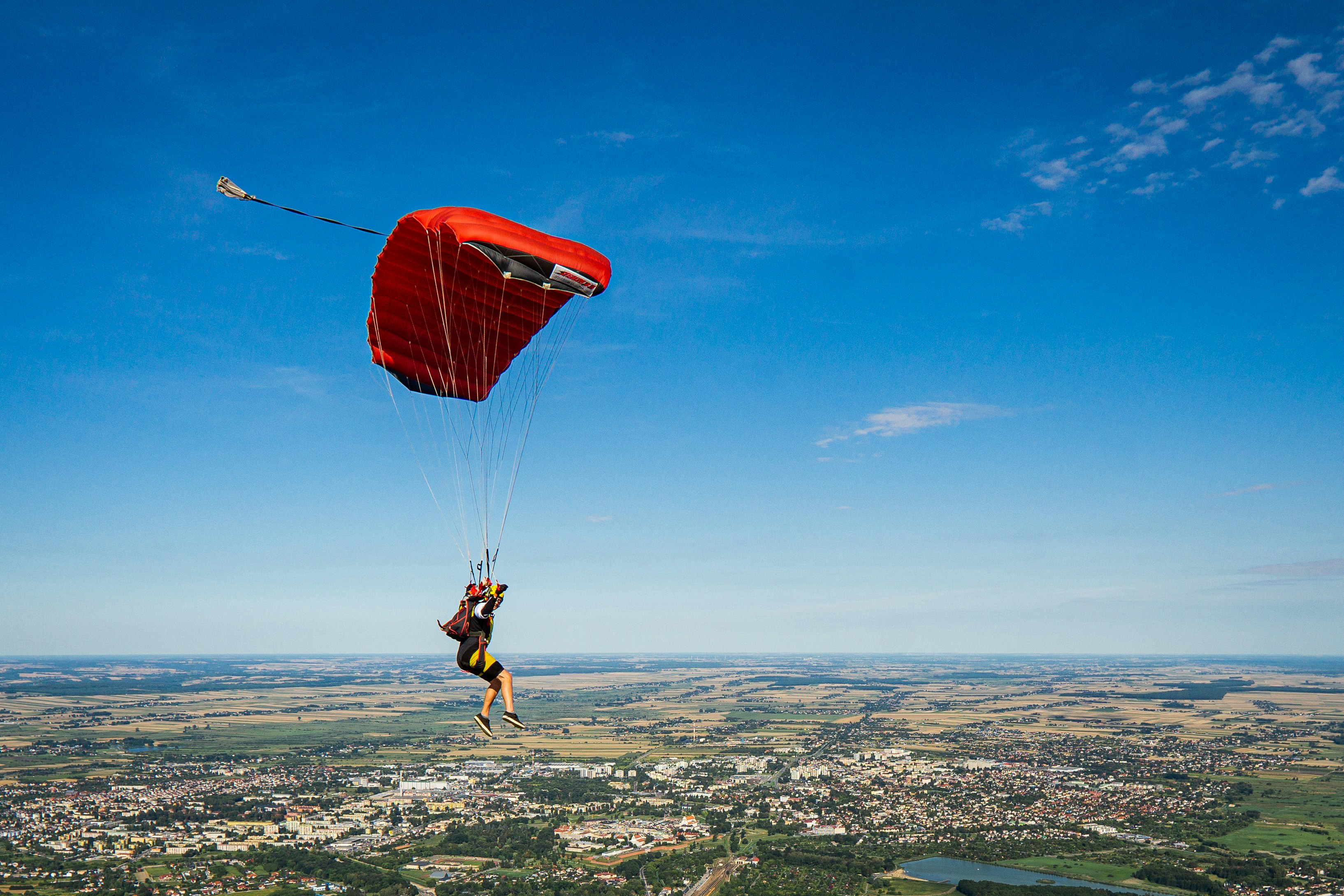 A person parachuting in the air photo – Free Parachute Image on Unsplash