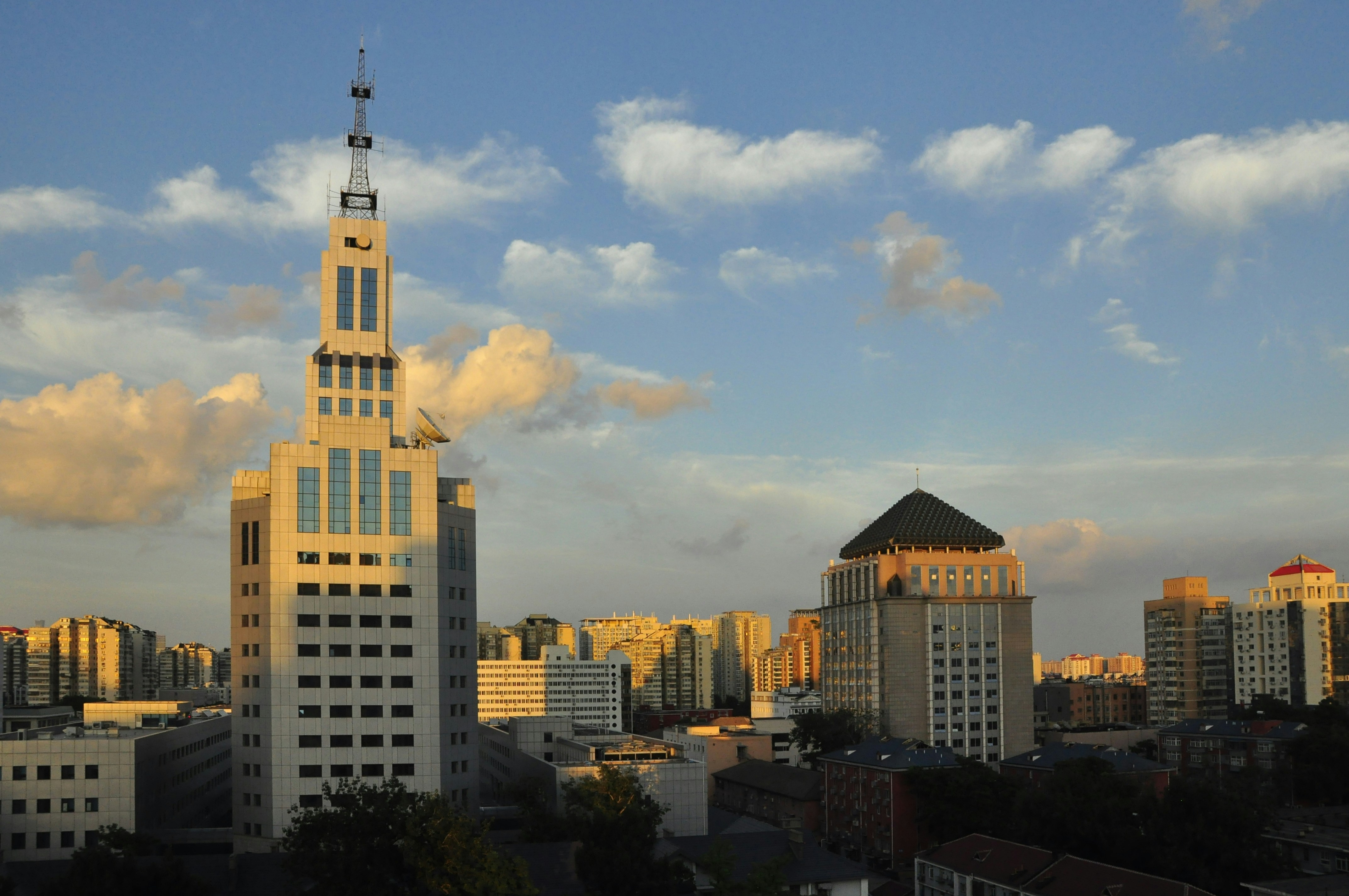 Amber-Spired Skyline Over a Grid of Modern Towers