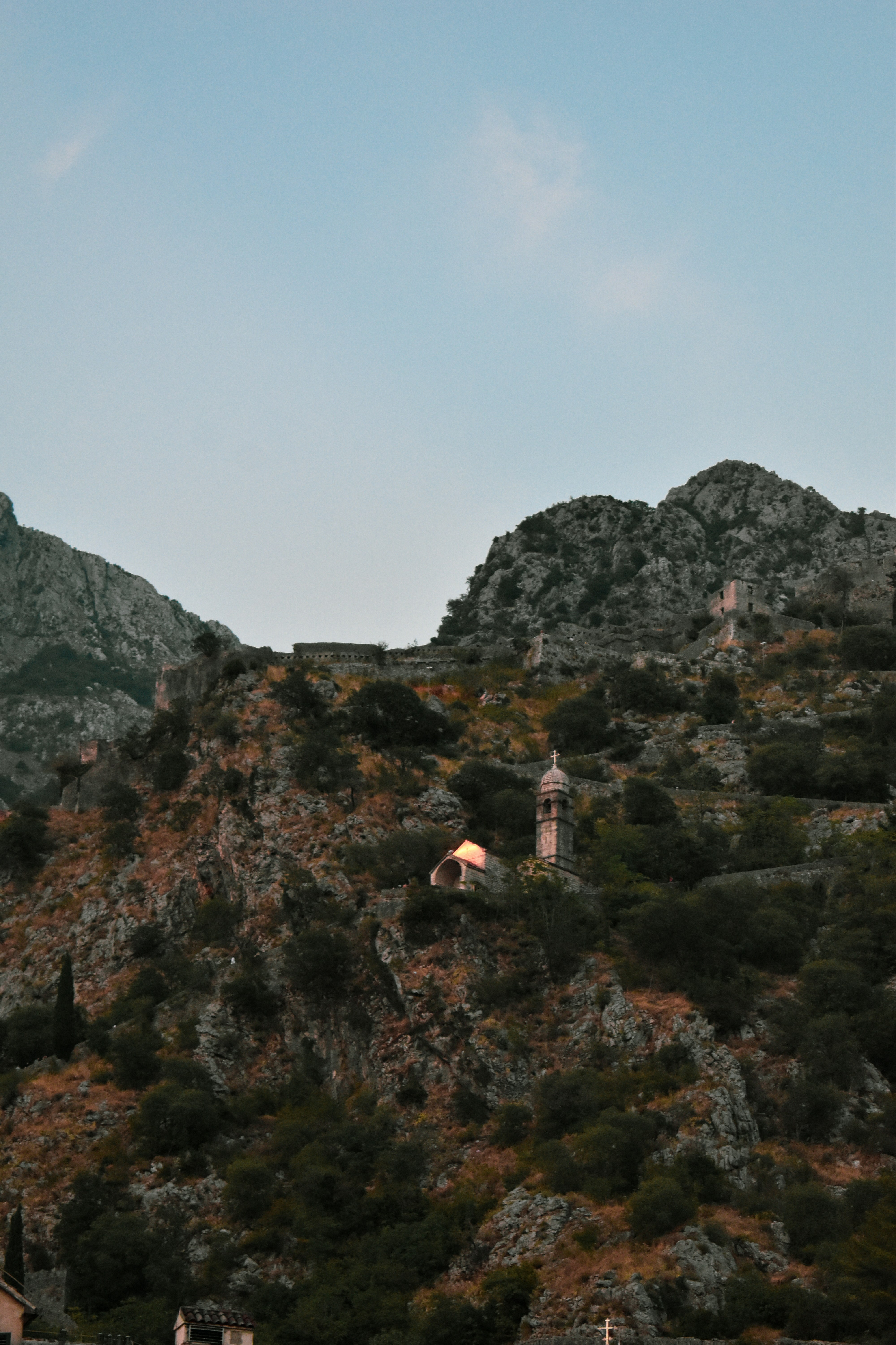 Bell Tower Among Ragged Hills: A Quiet Chapel Clings to the Cliff
