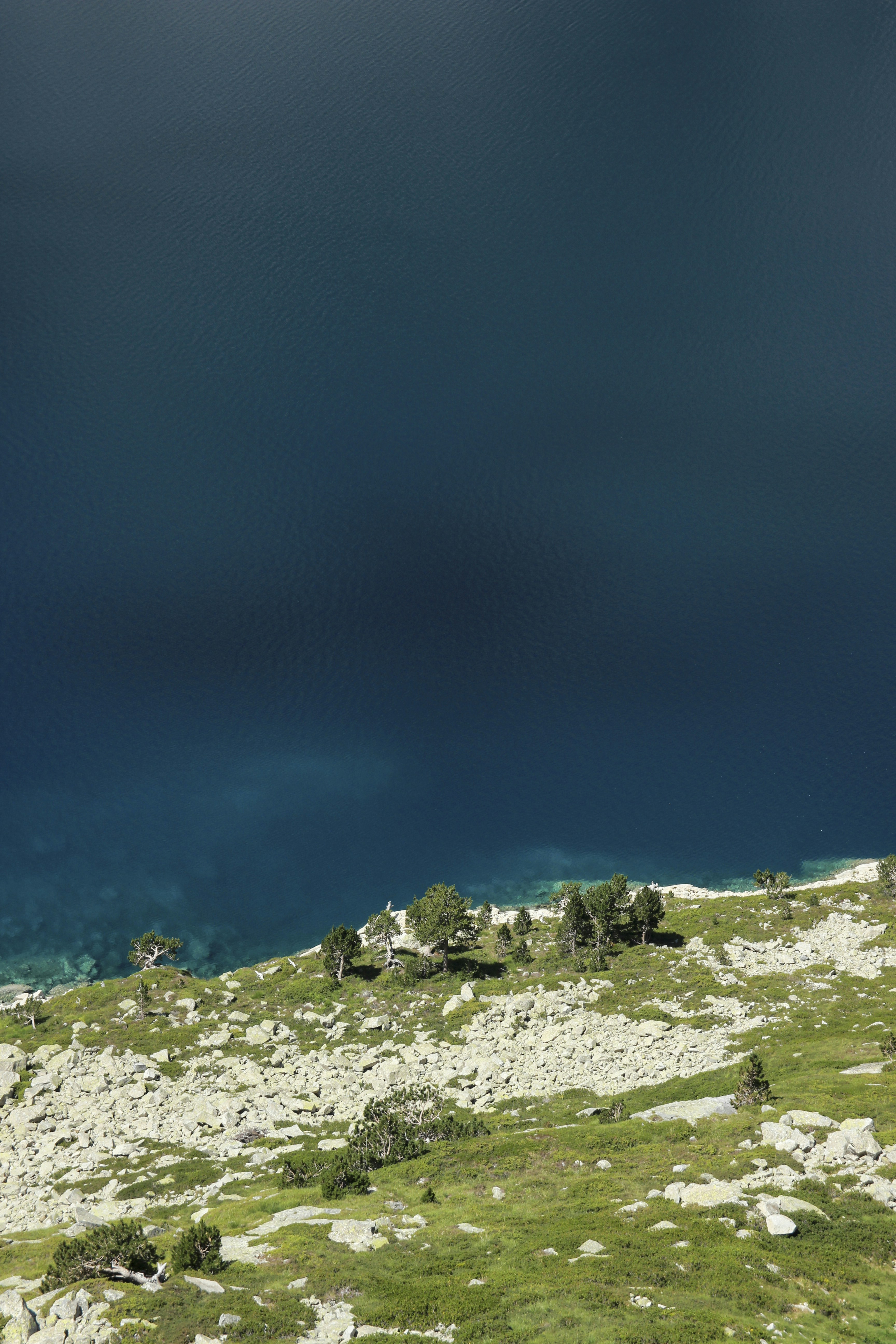Emerald Slope at the Shoreline: Quiet Convergence with the Abyss