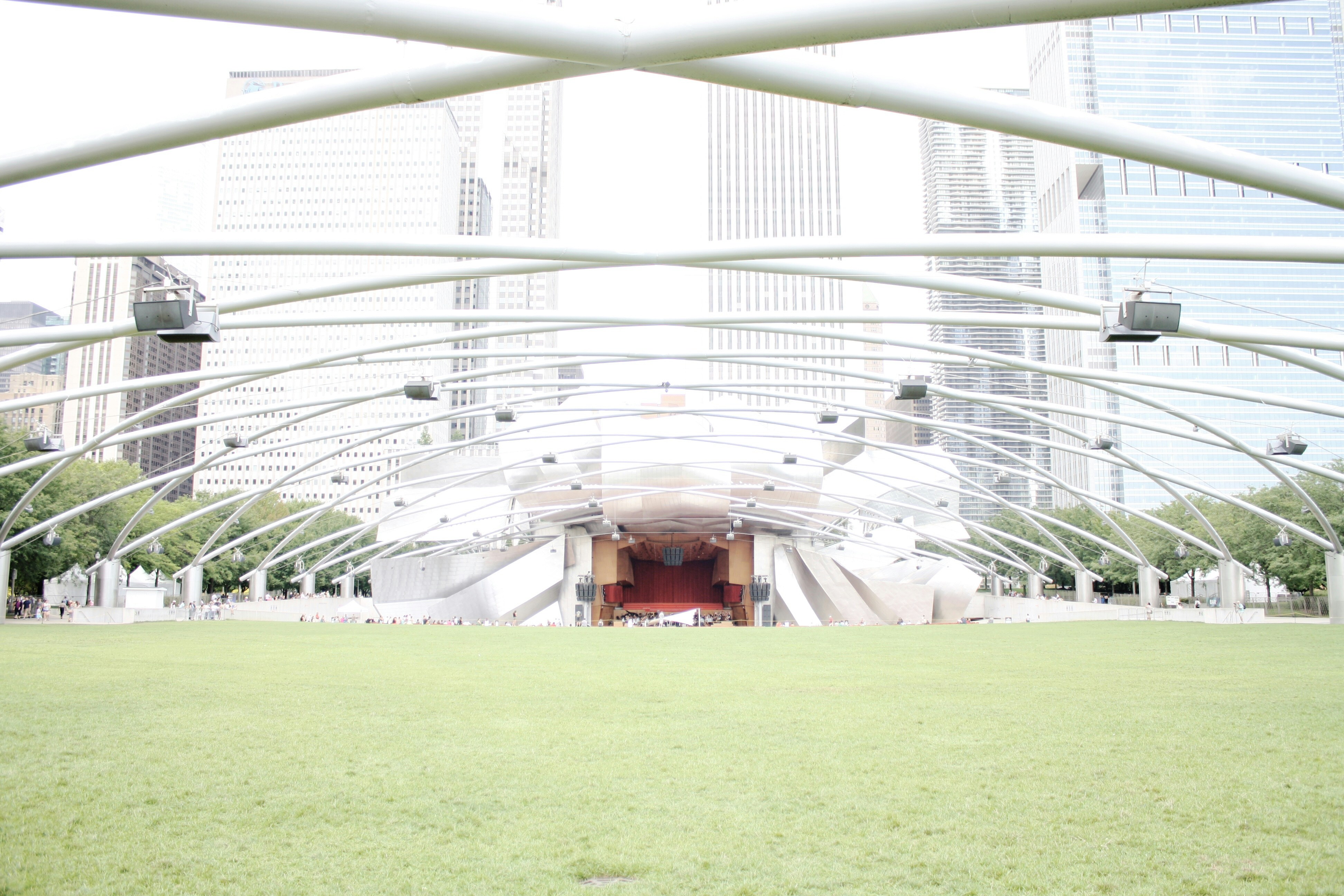 Ribbed Arcades Converge on a Crimson Door at the Park's End