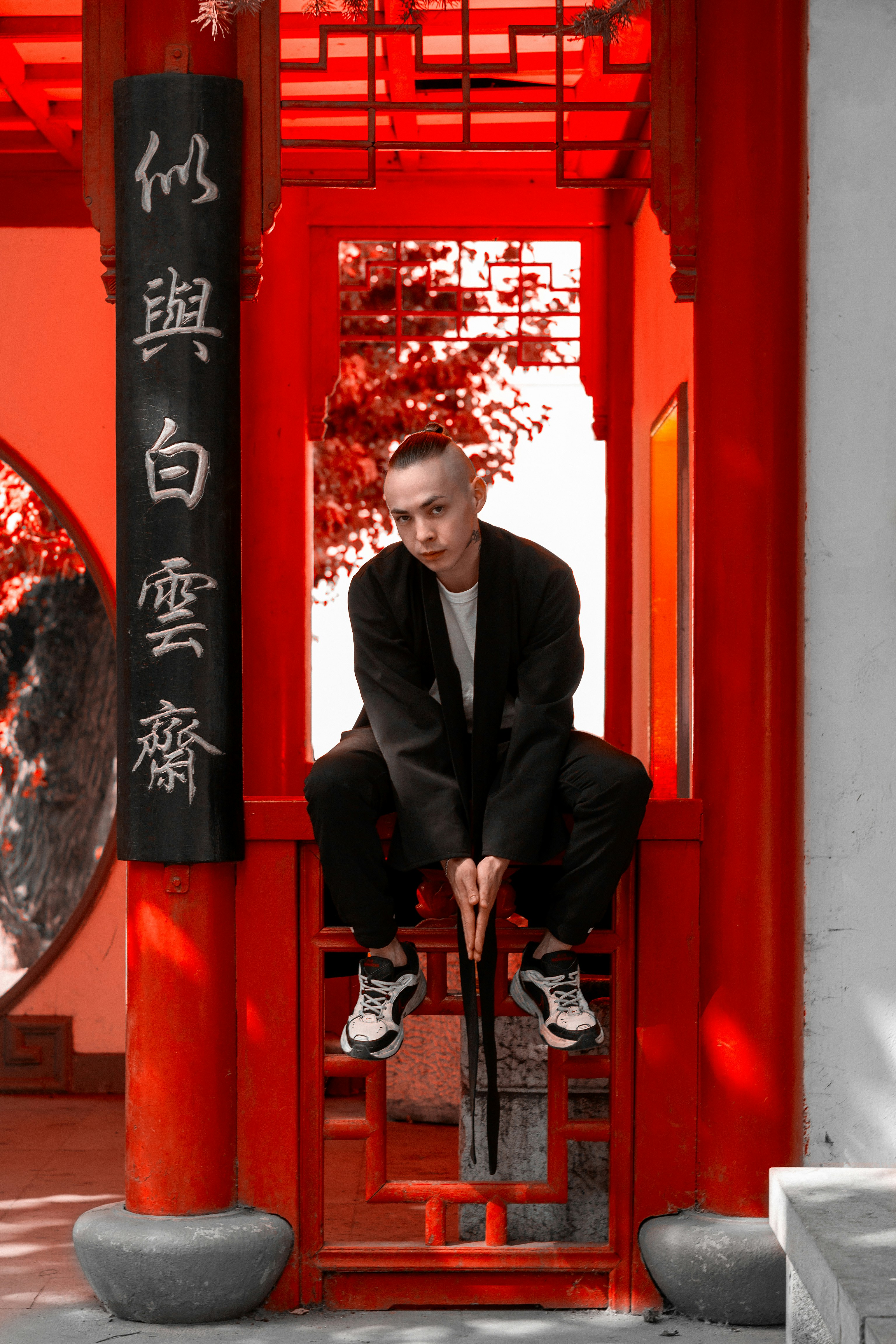Crimson Gatekeeper: A Minimalist Portrait within a Red Temple Portal