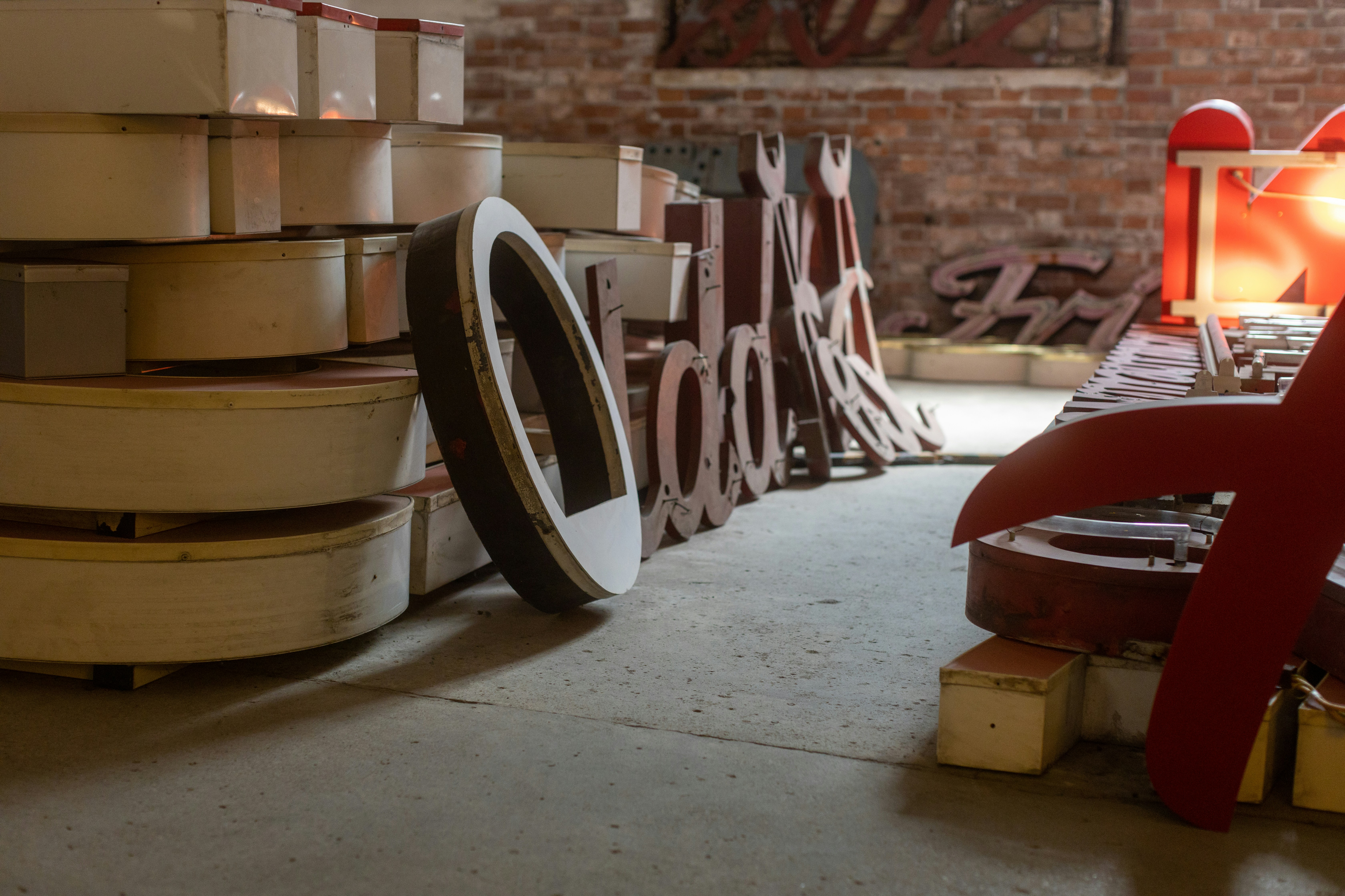 Industrial Signage in a Dim Charred Brick Workshop