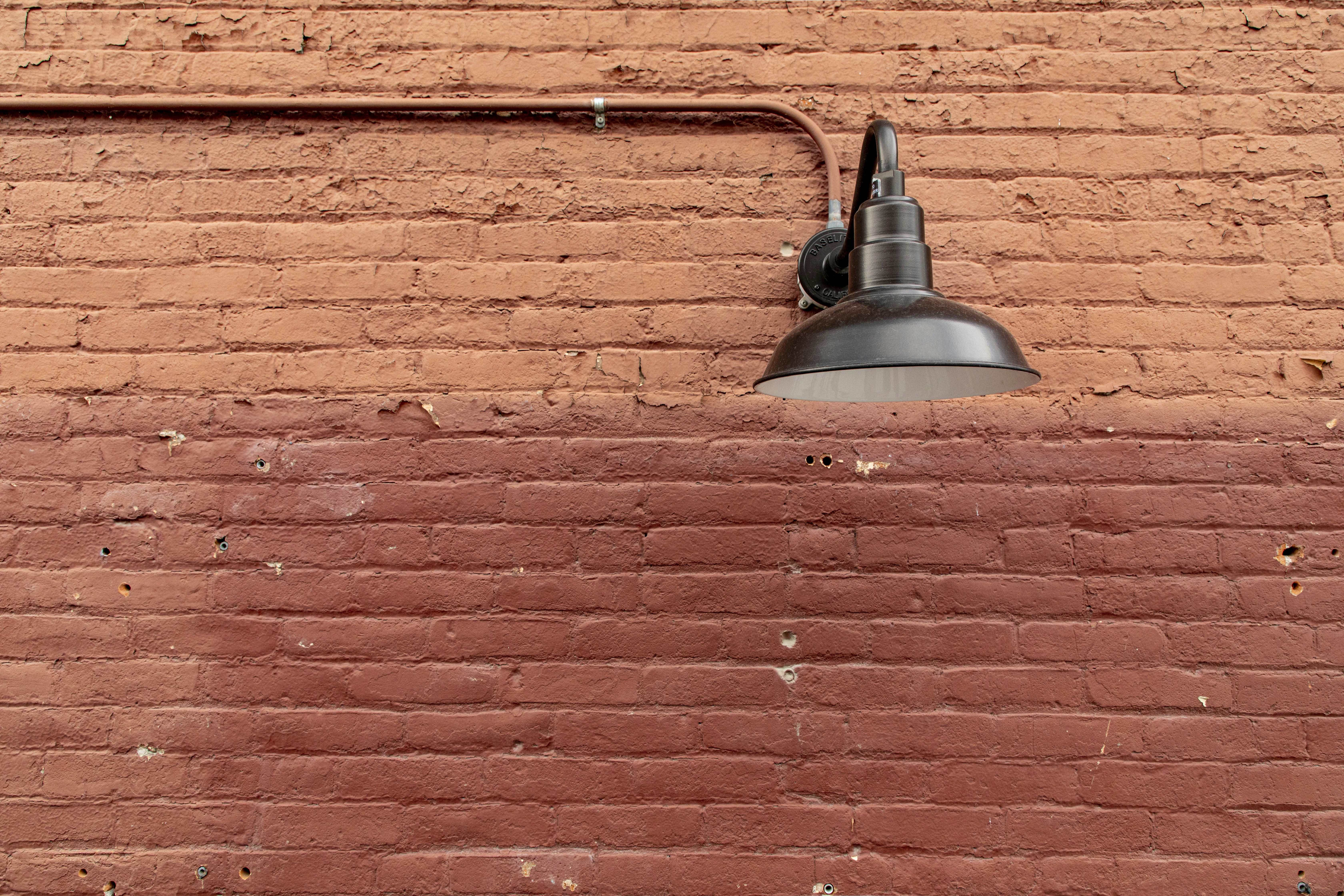 A bell on a brick wall photo – Free Usa Image on Unsplash