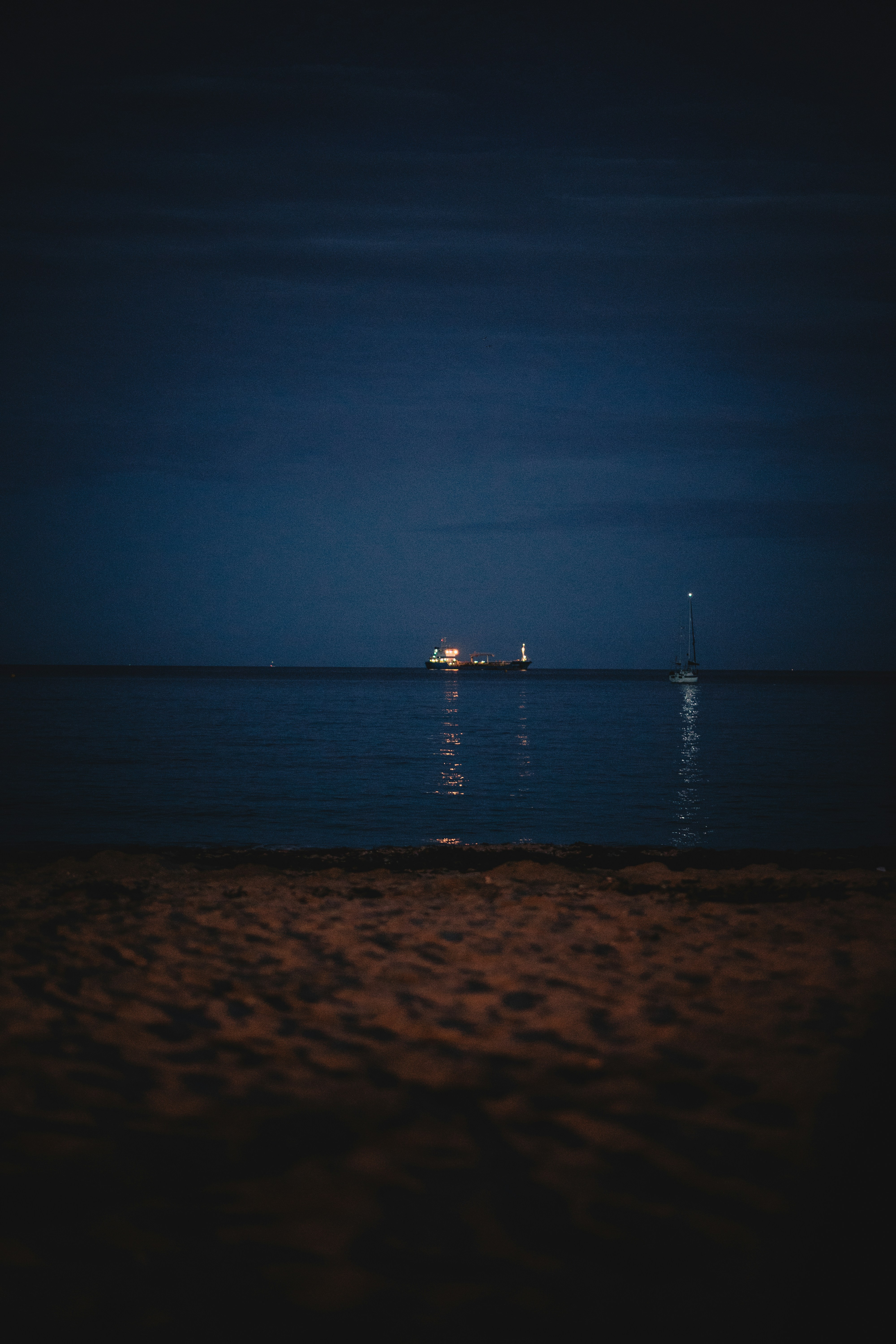 Midnight Harbor Light: A Glowing Vessel Quietly Anchored on a Velvet Sea