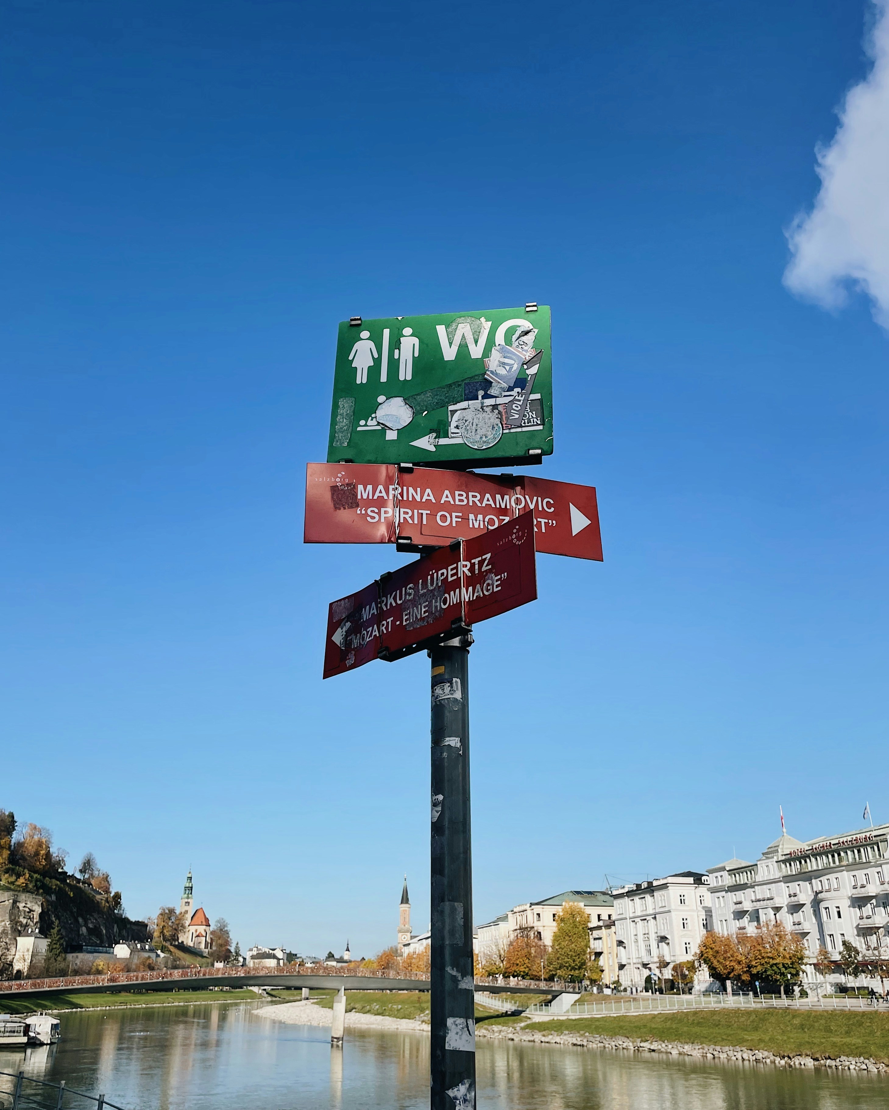 a sign with a couple of street signs on it