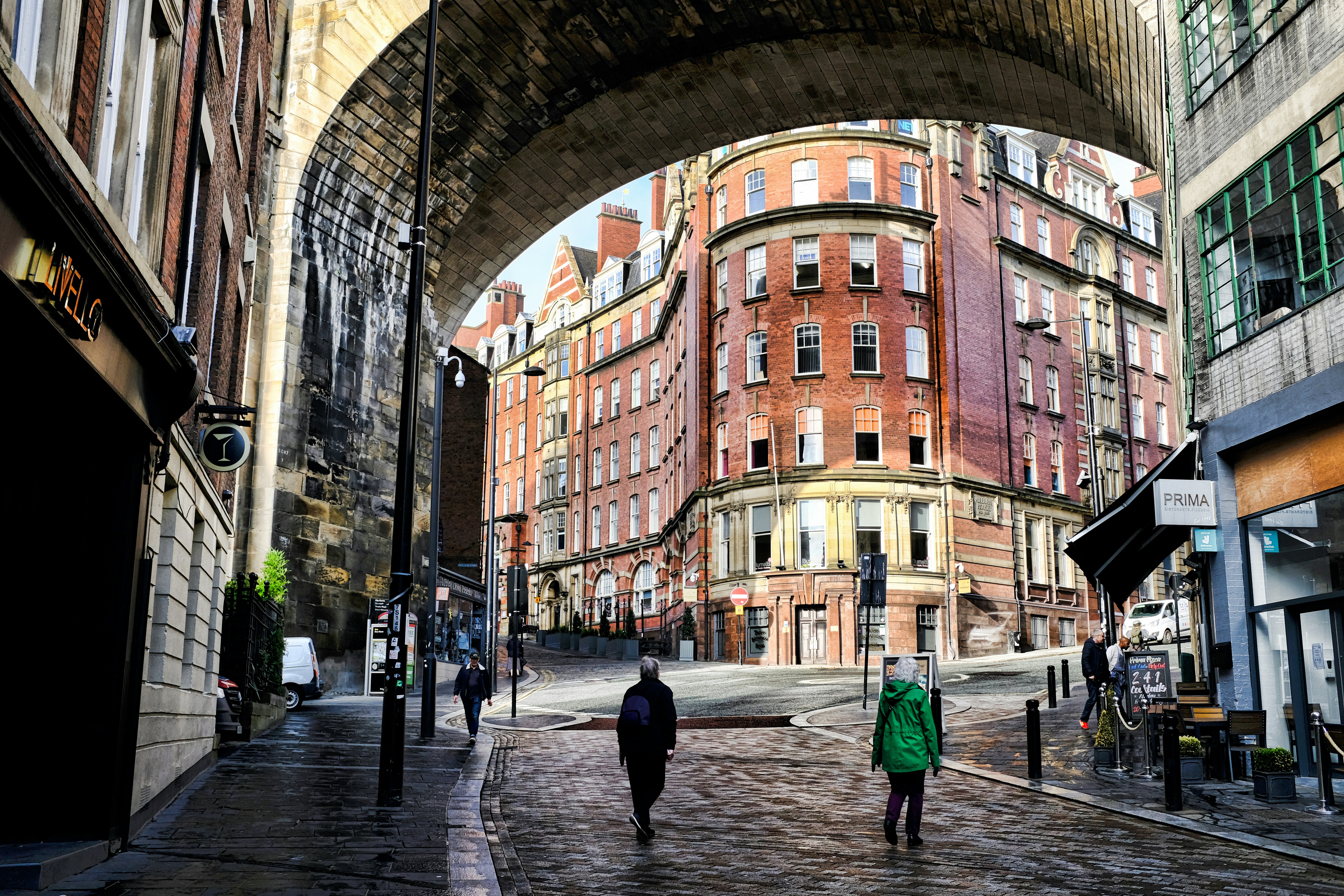 A brick walkway between buildings photo – Free Dean street Image on ...