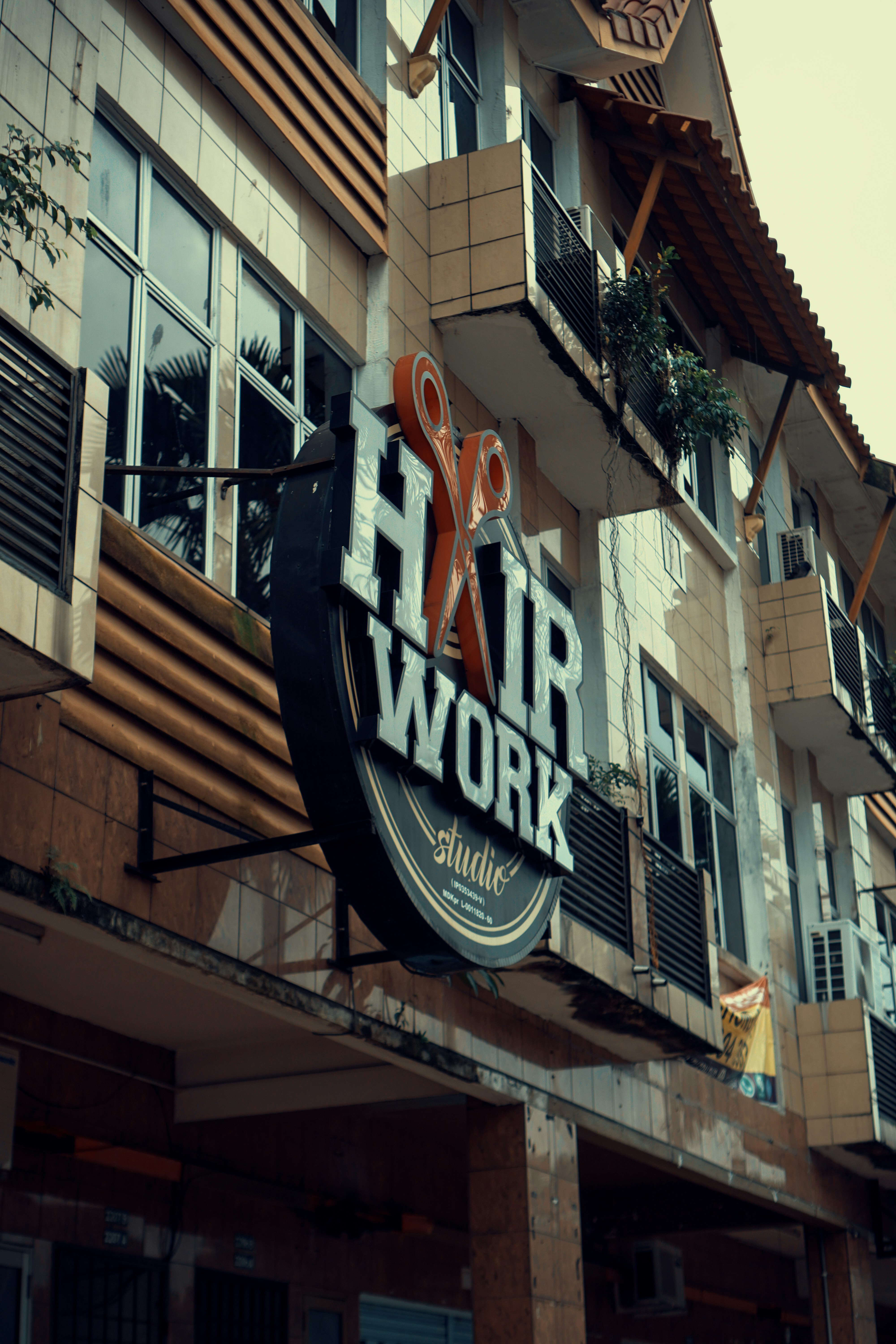 A sign on a building photo – Free Bandar baru kampar Image on Unsplash