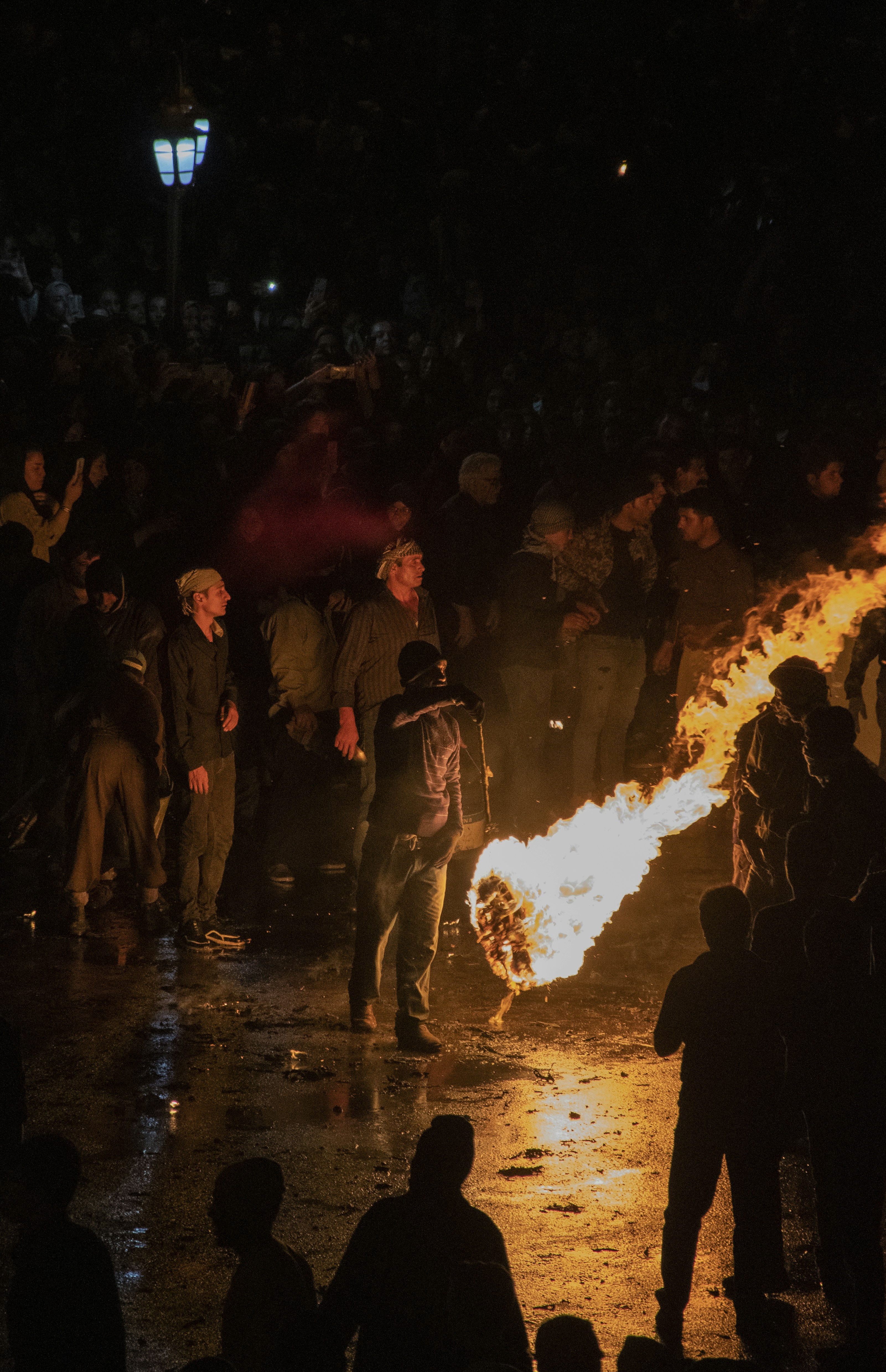 A group of people around a fire photo – Free Iran Image on Unsplash