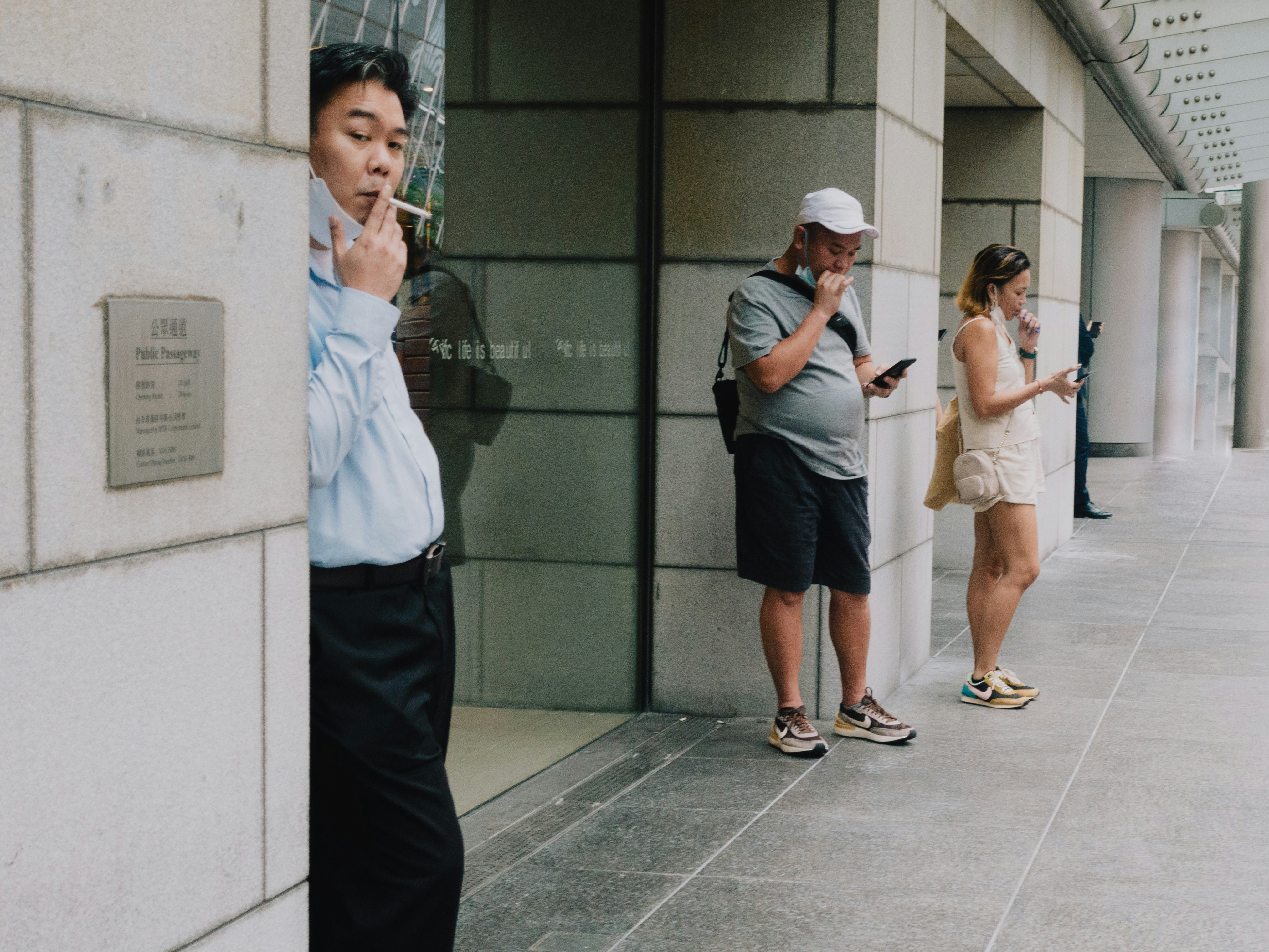 A group of people standing outside a building photo – Free Grey Image ...