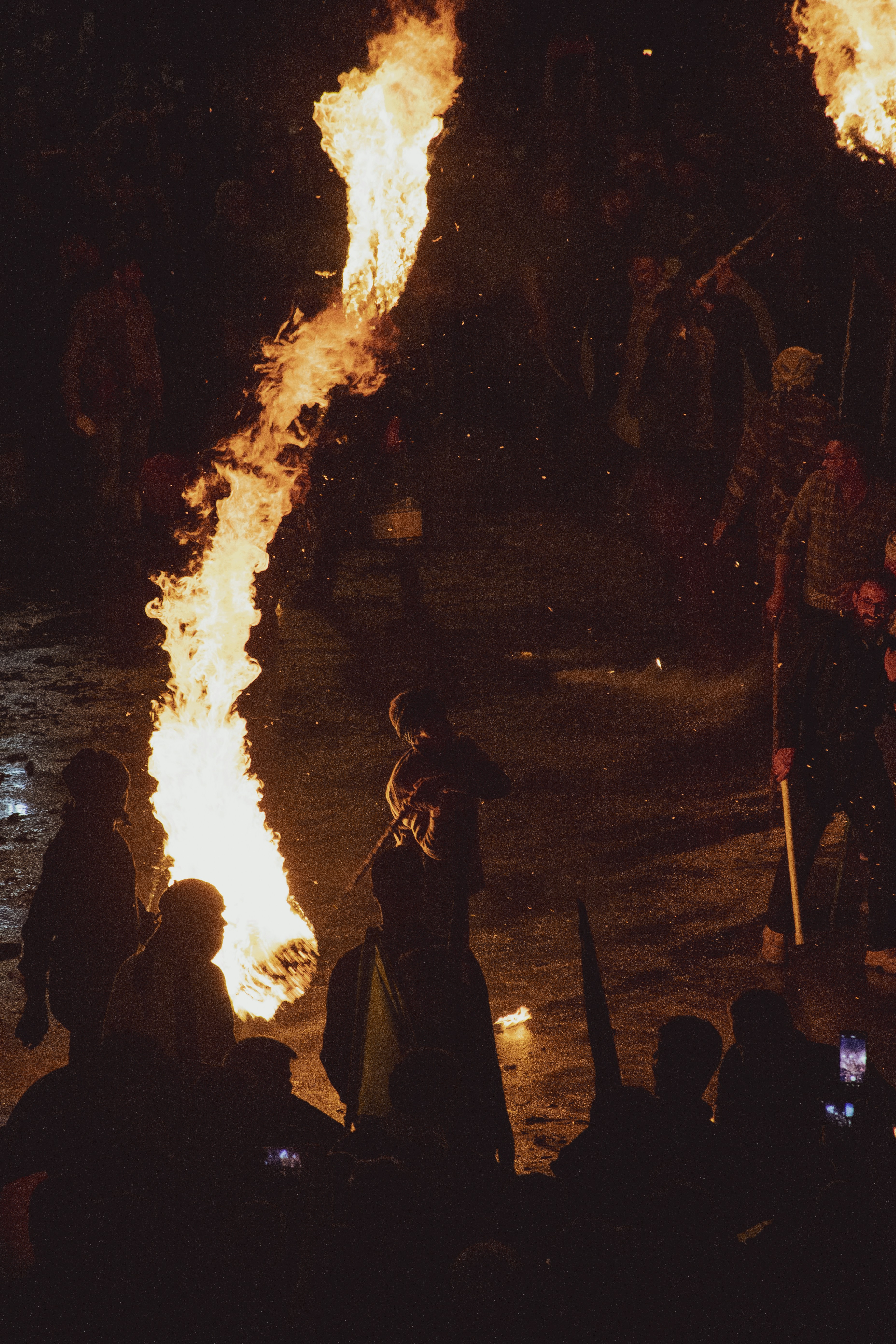 A group of people around a fire photo – Free Shishavan Image on Unsplash