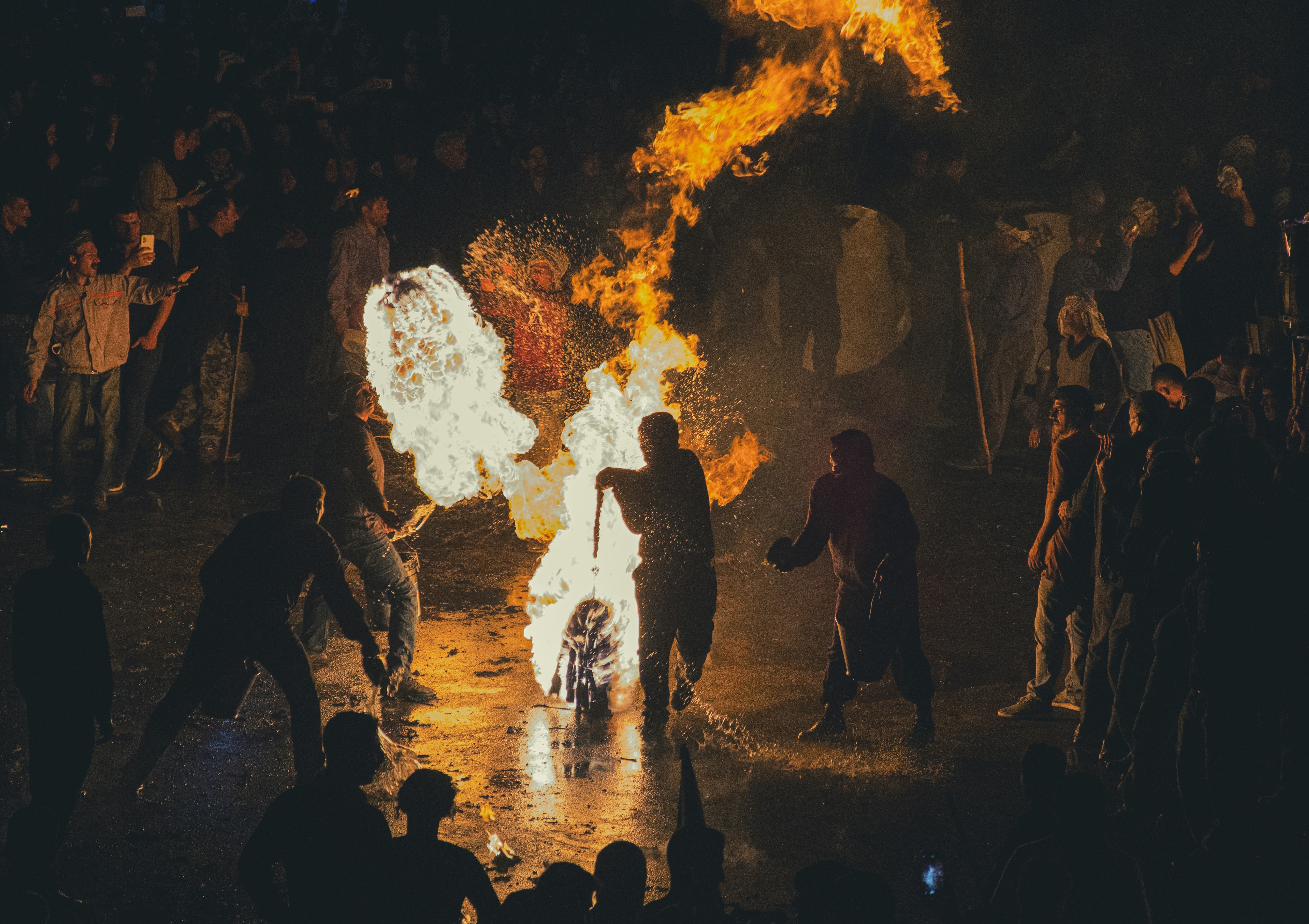A group of people around a fire photo – Free Shishavan Image on Unsplash