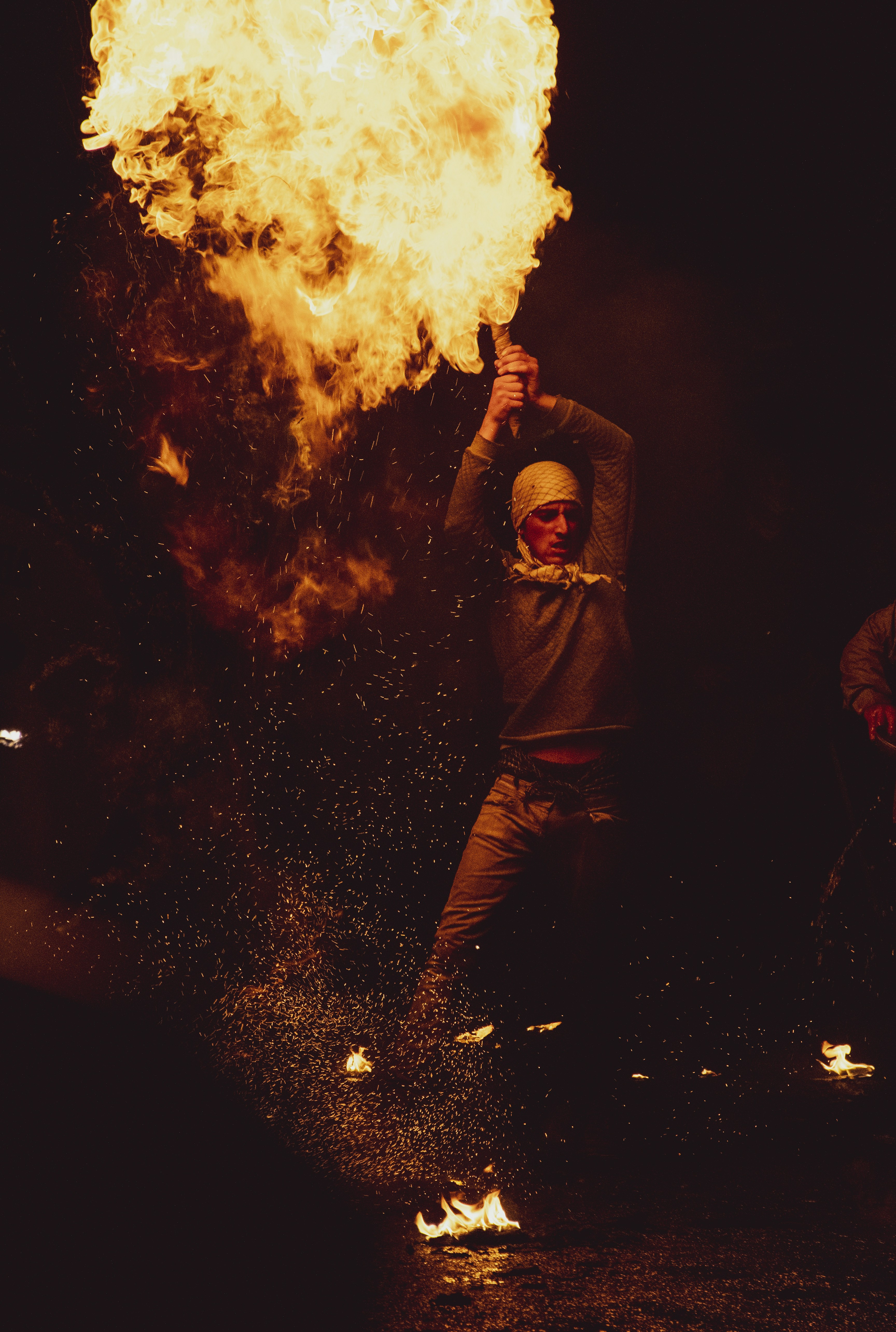 A person standing in front of a large fire photo – Free Iran Image on ...