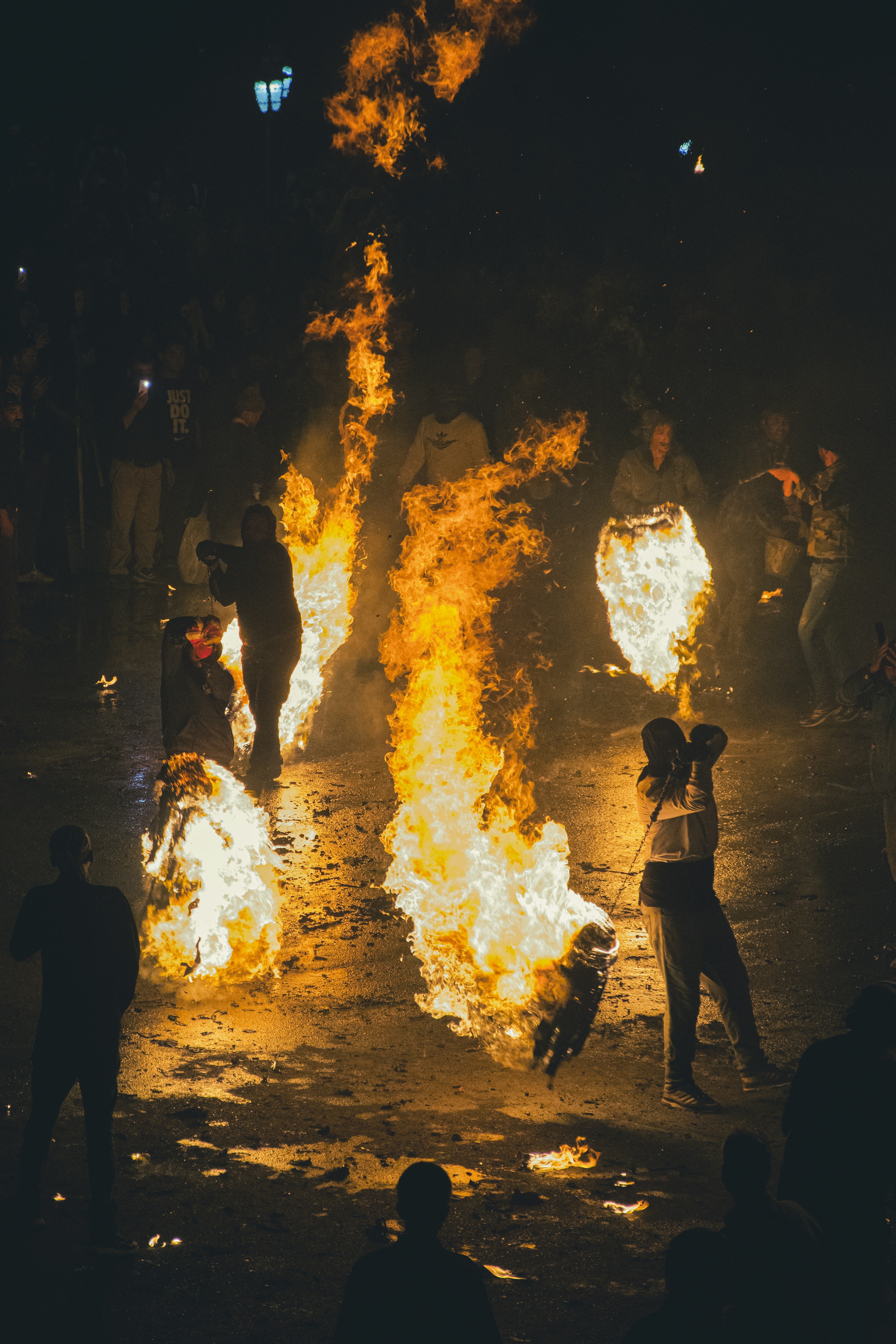 A group of people around a fire photo – Free Fire Image on Unsplash