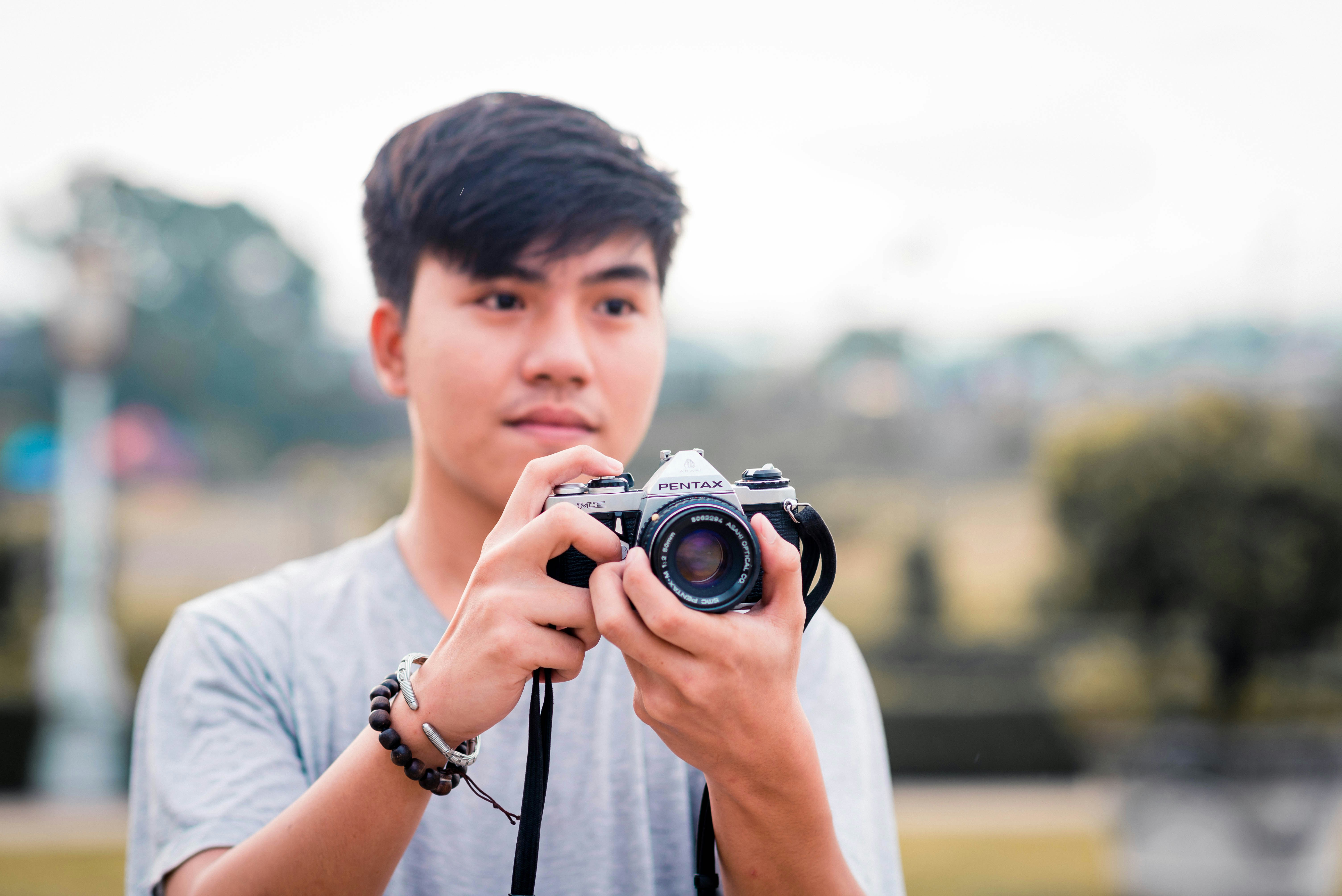 A person holding a camera photo – Free Film photography Image on Unsplash