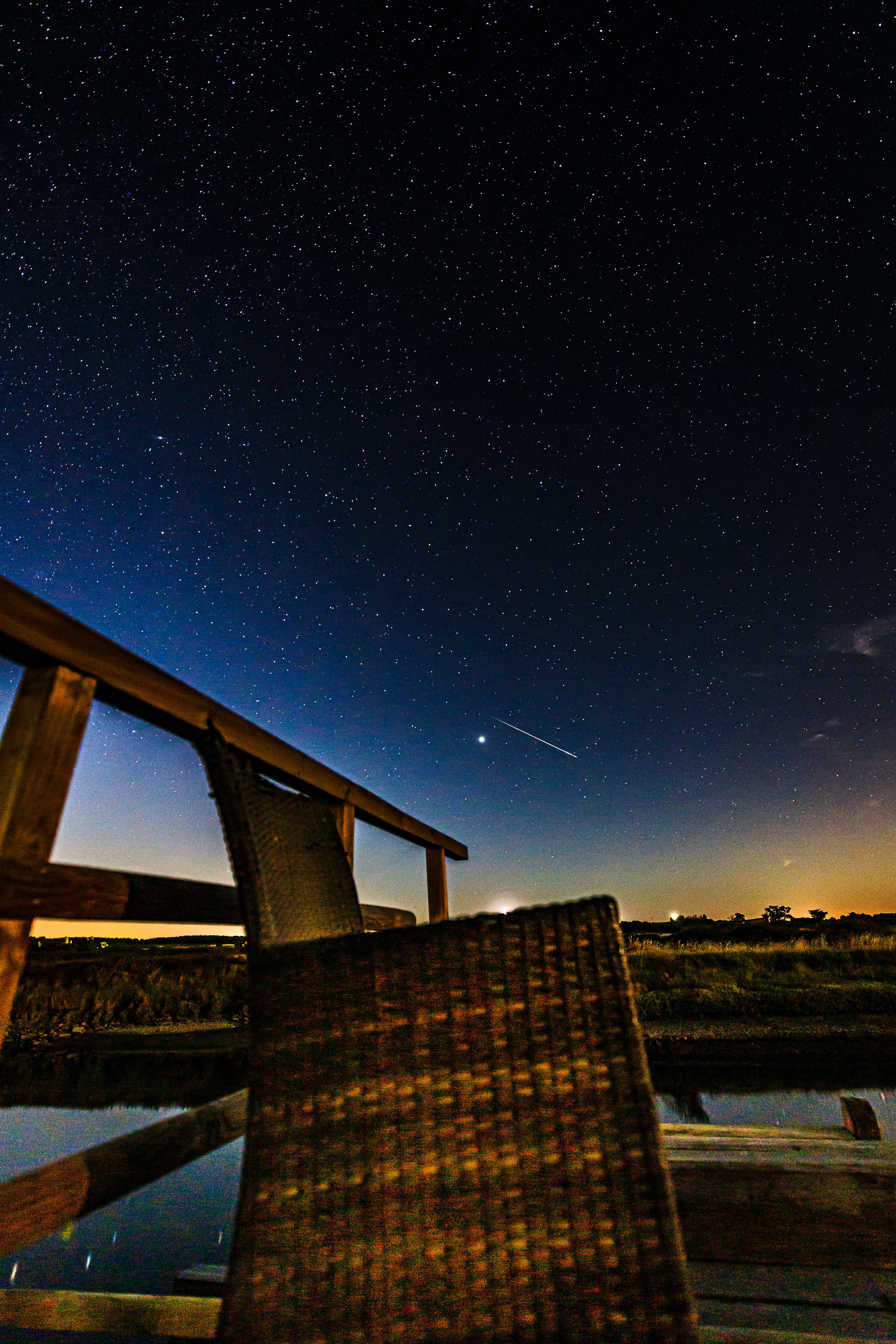 Meteor Threading the Velvet Night Above a Weathered Lakeside Deck