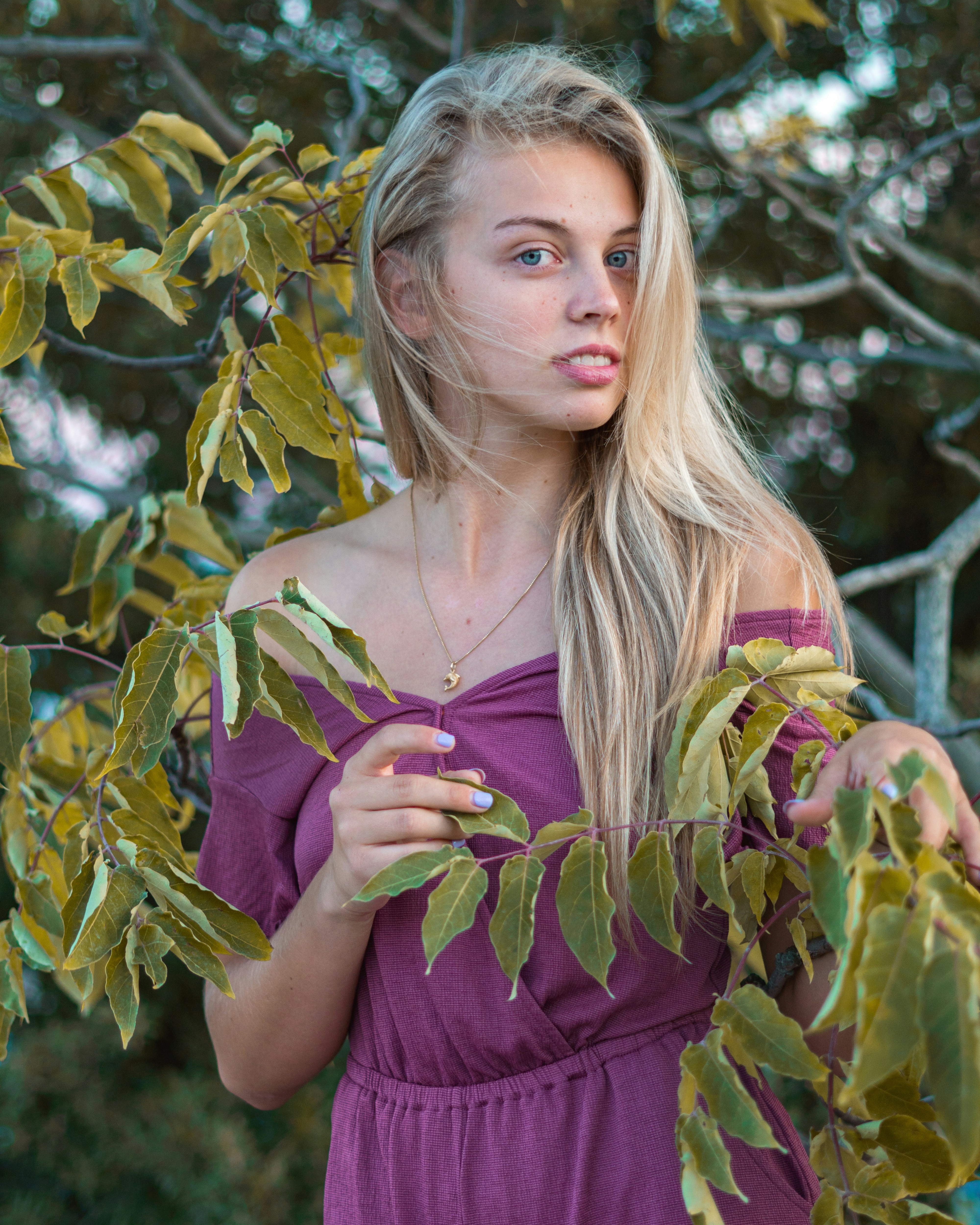a woman in a purple dress