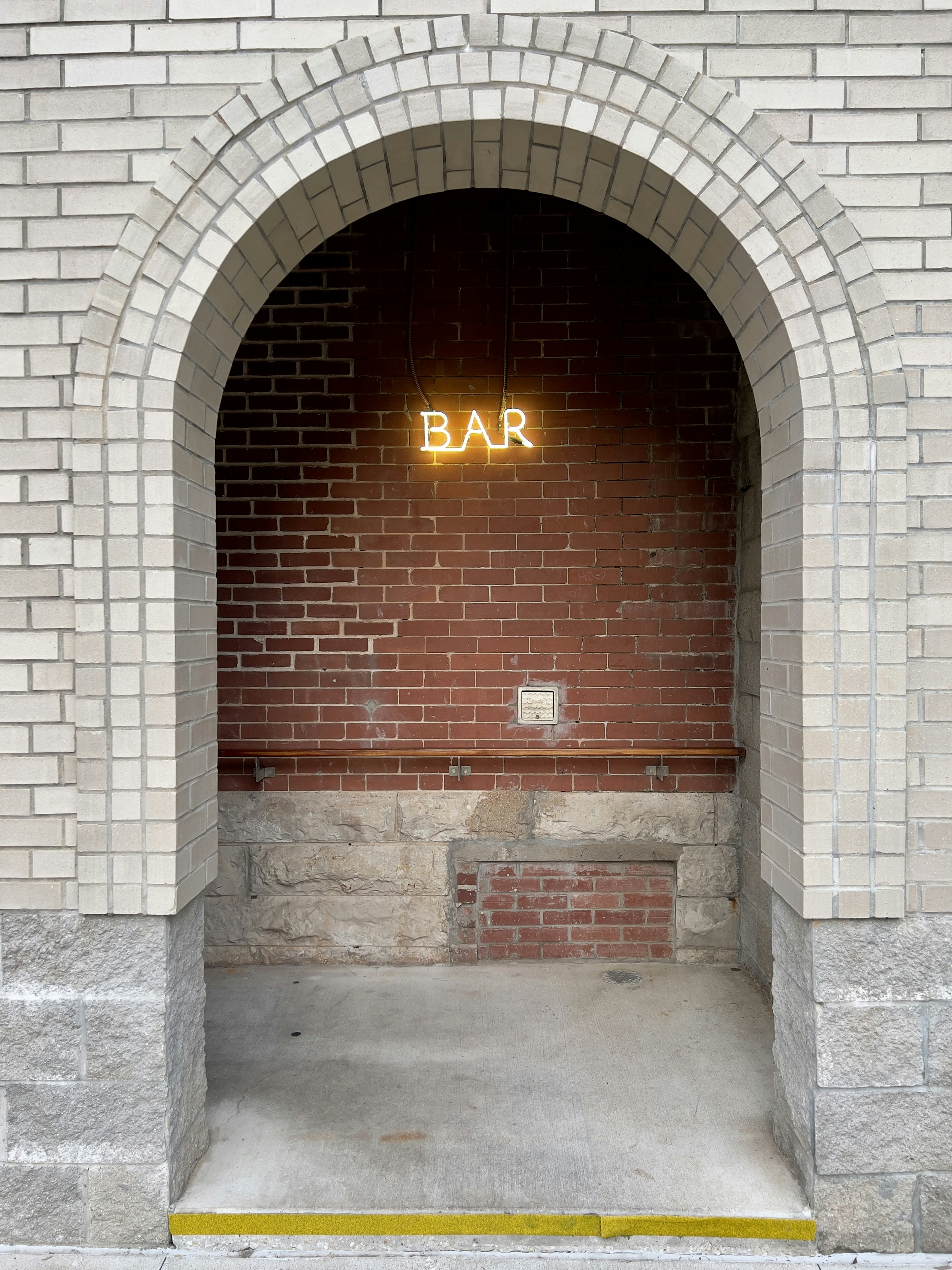 a brick tunnel with a light