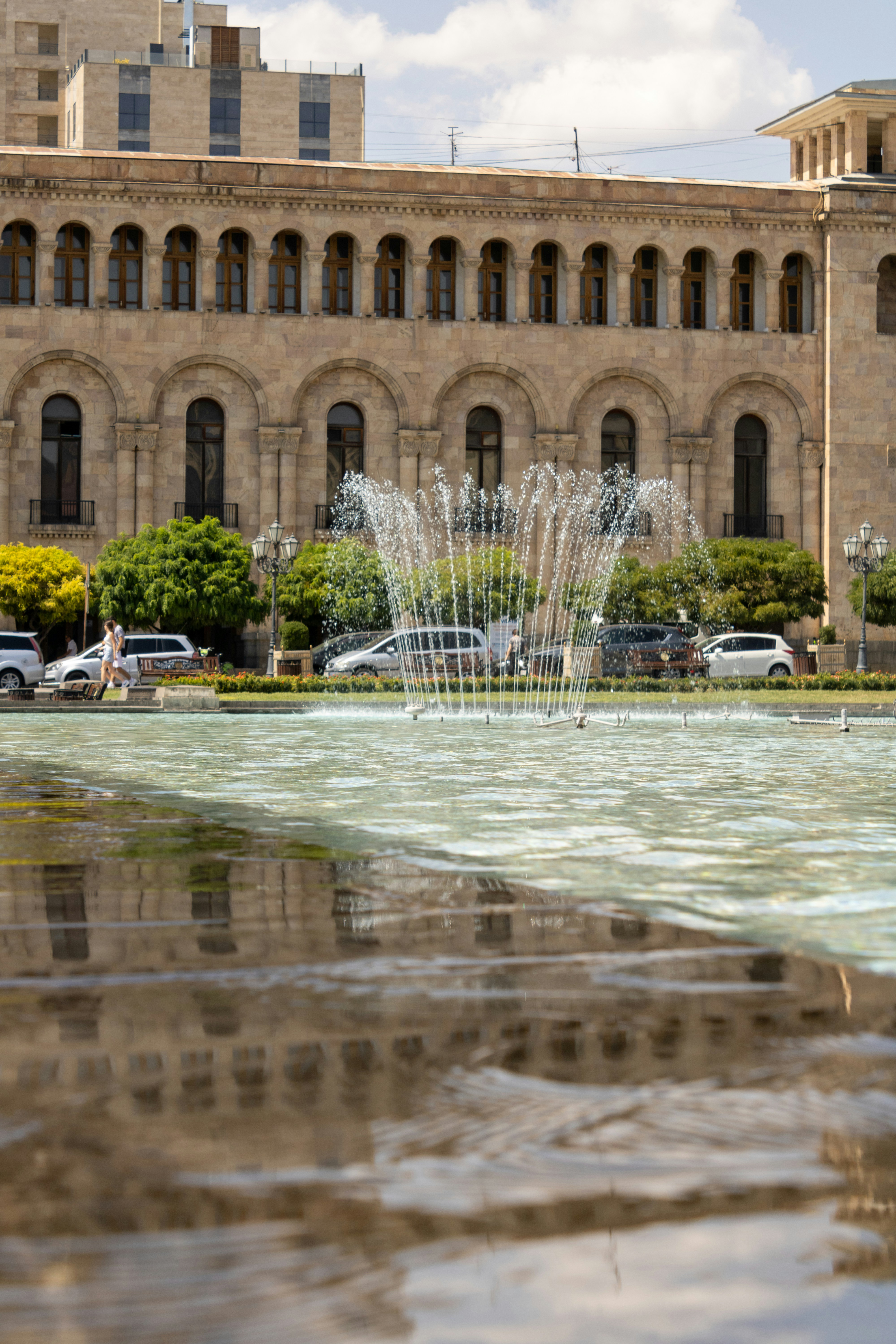 a fountain in front of a building