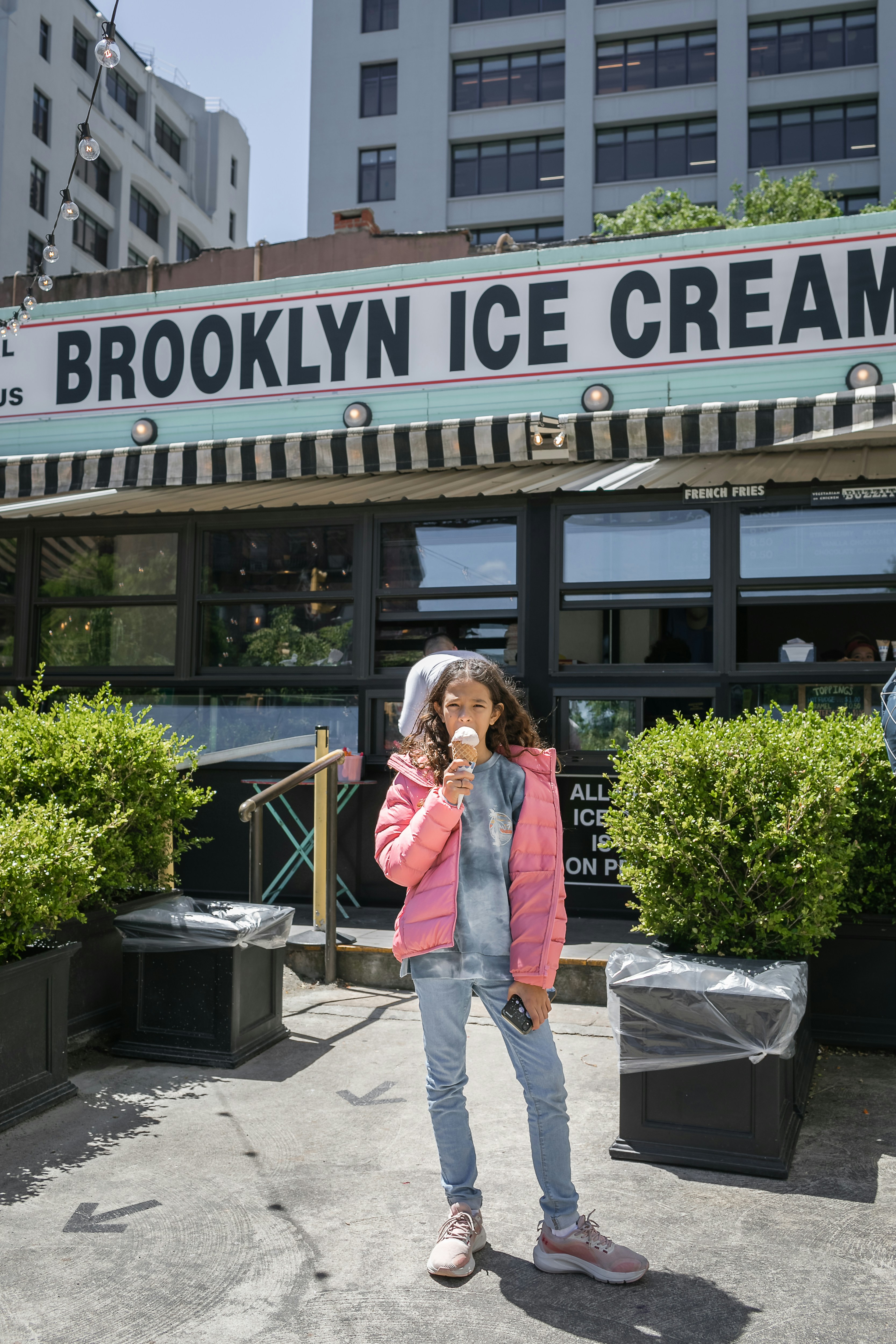 A person standing outside a building photo – Free Image on Unsplash