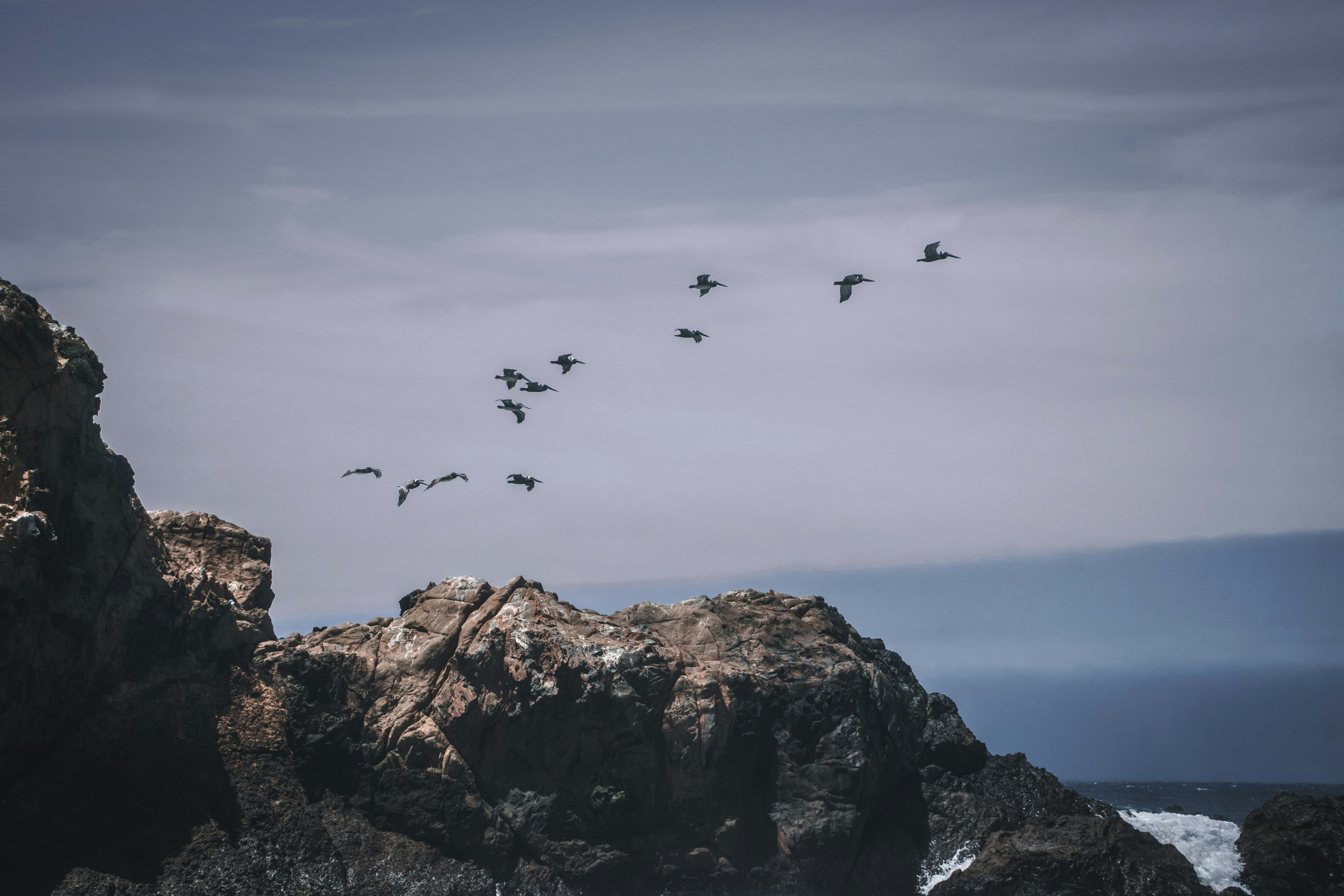 Flight Path Over Rugged Cliffs at Dusk