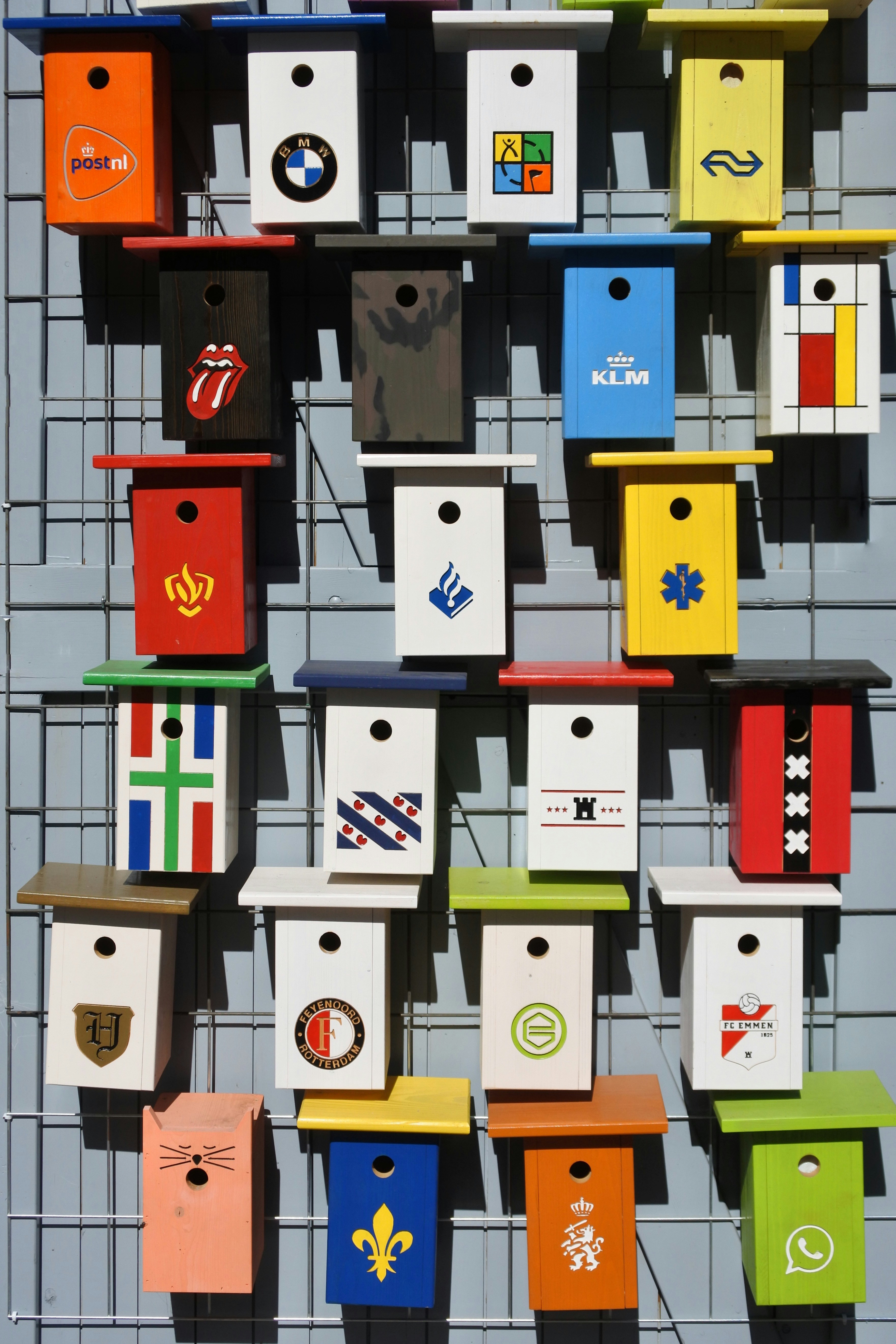 Rainbow Inbox: A Wall of Colorful Mailboxes in Quiet Order