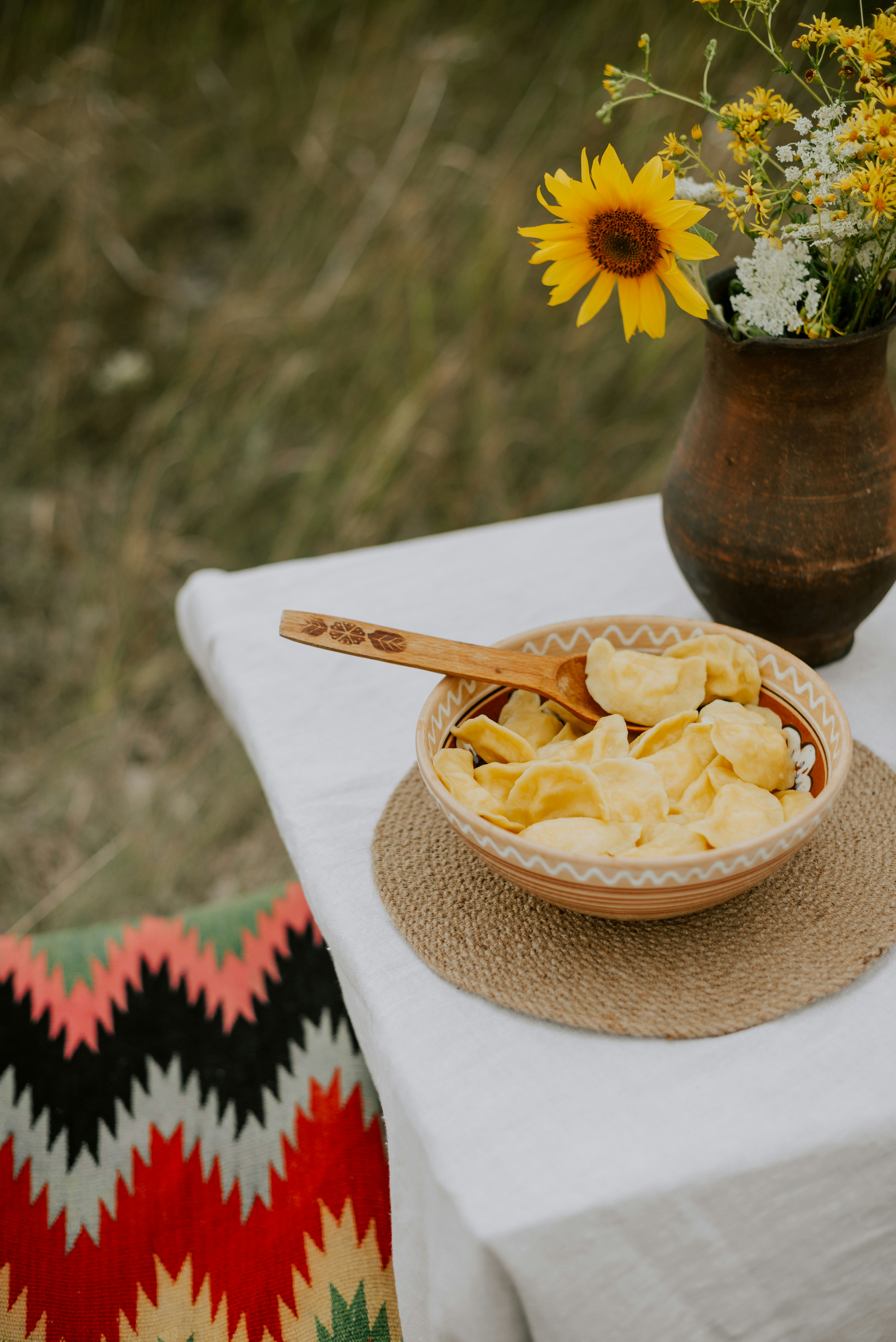 Sunflower and Pottery on a Table Set for a Meadow Picnic