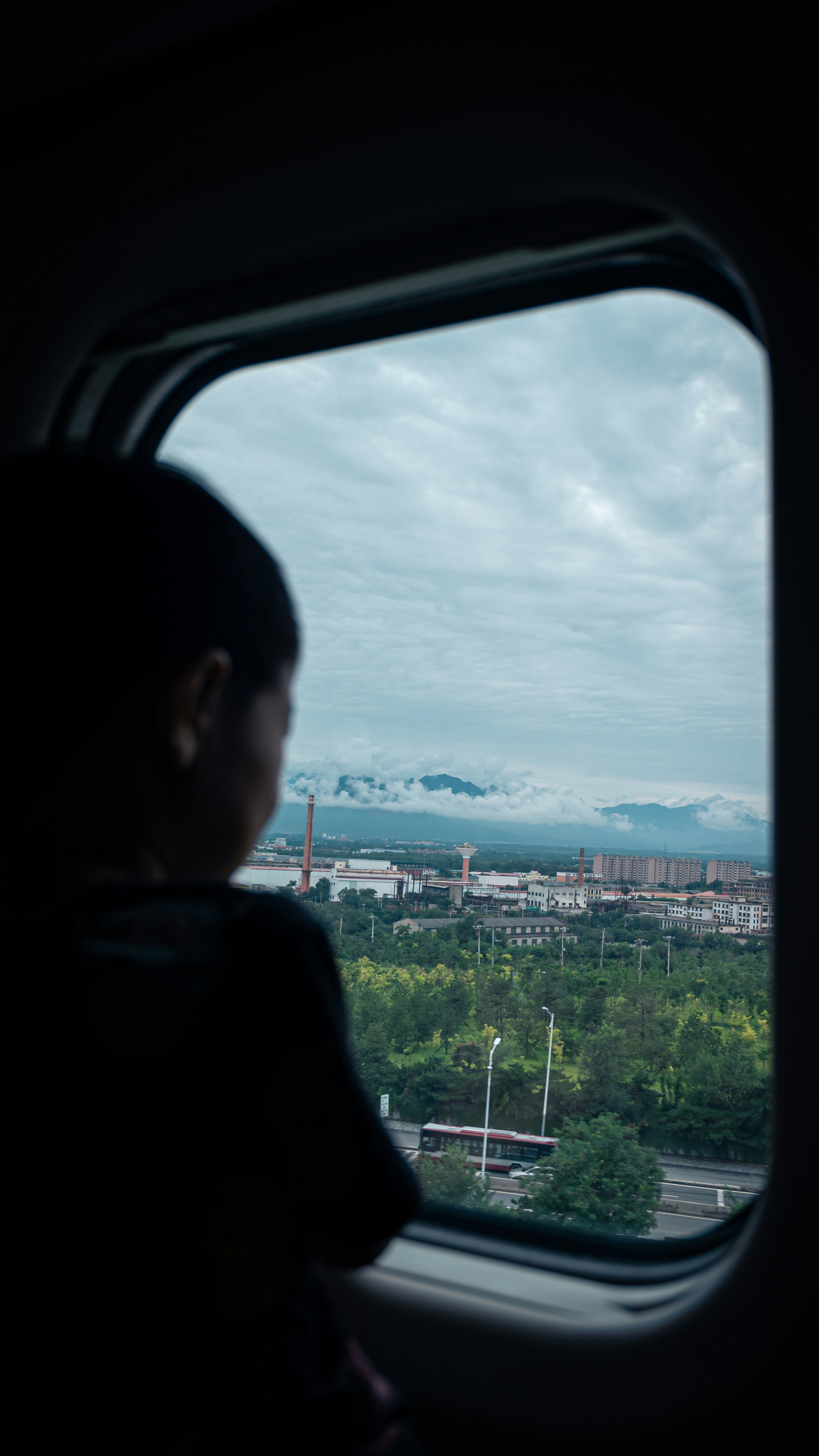 A person looking out a window photo – Free Yanqing Image on Unsplash