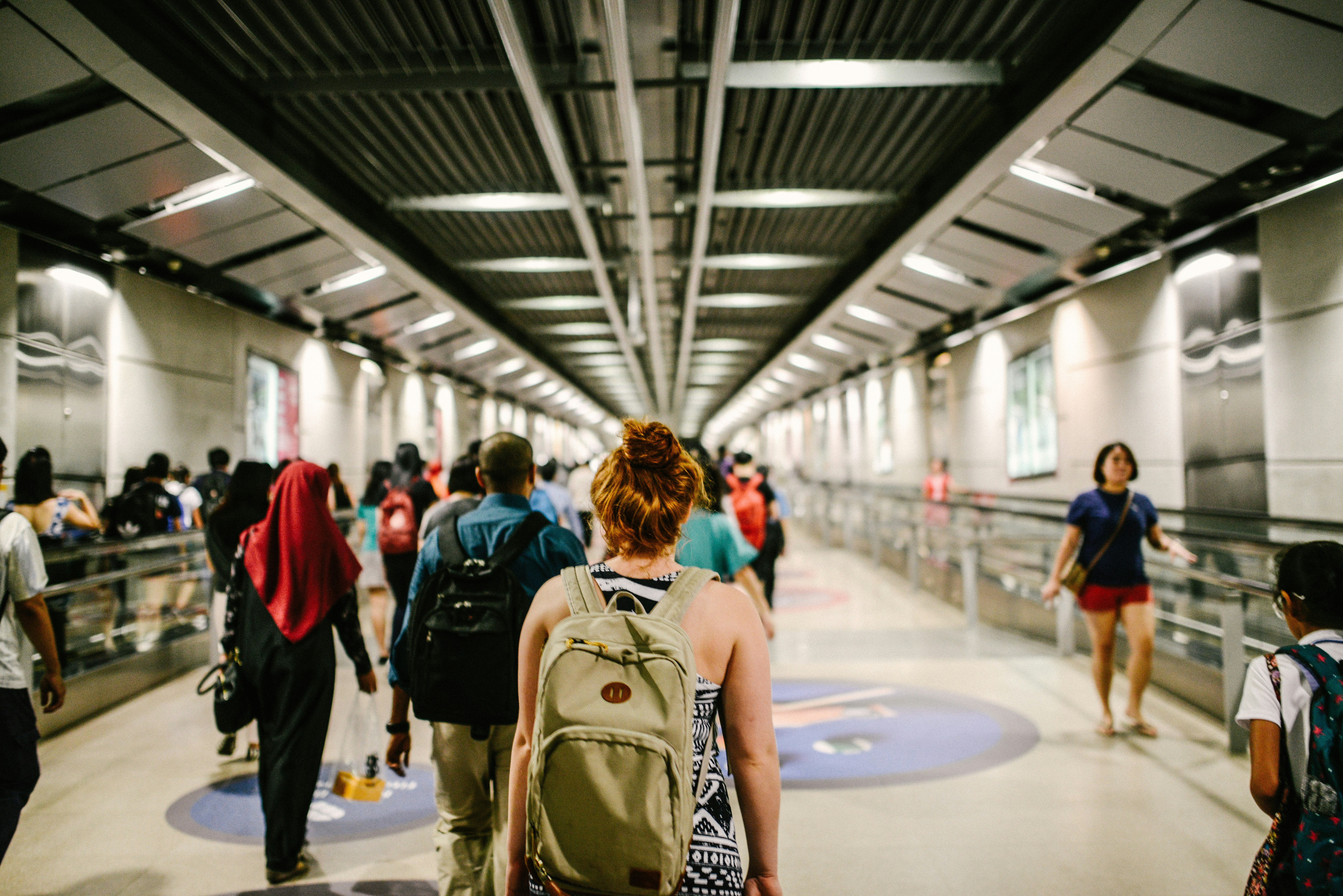 A group of people walking in a train station photo – Free Human Image ...