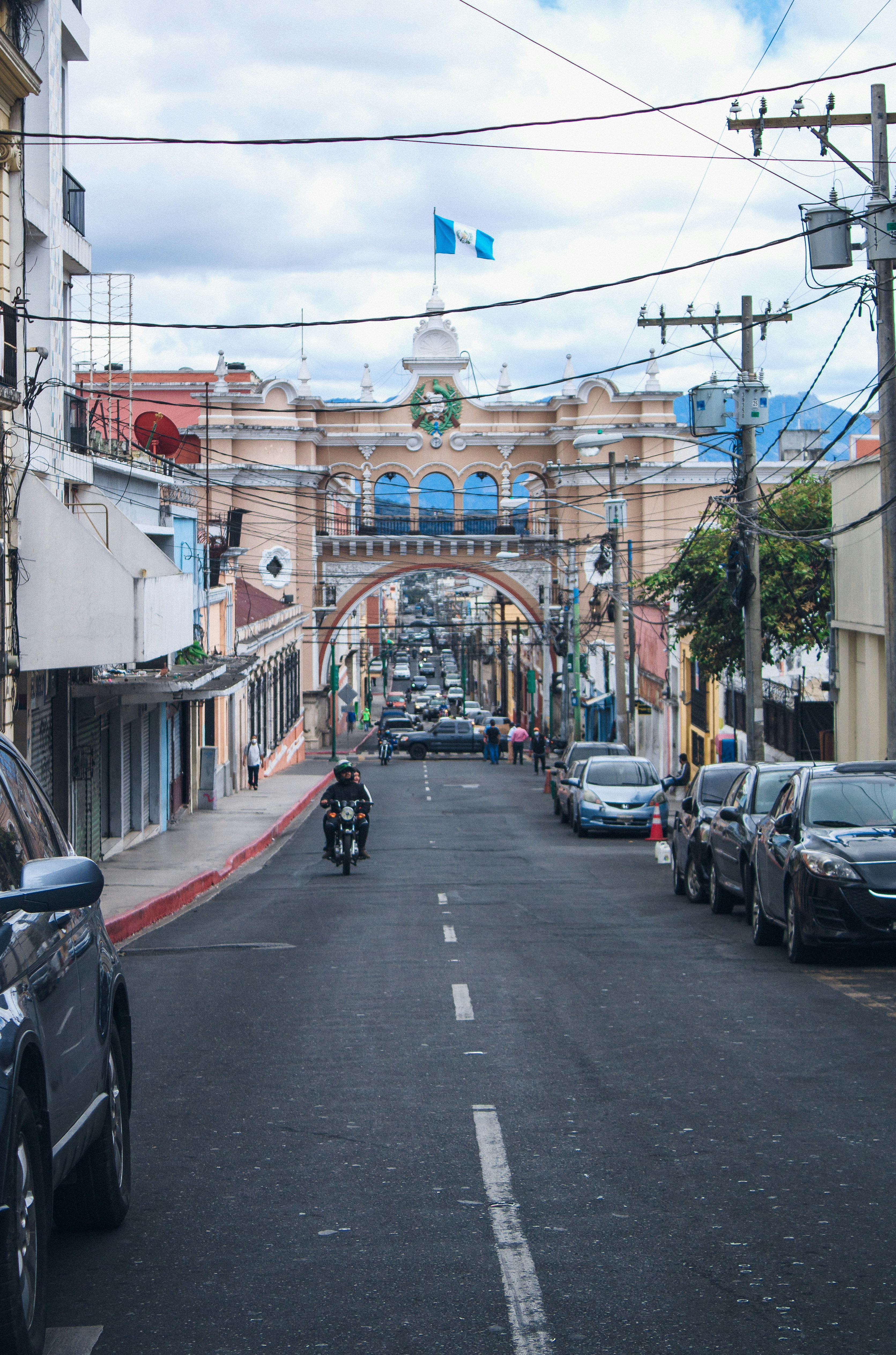 Archway Vista: Street Perspective Toward a Flag-Topped Gateway