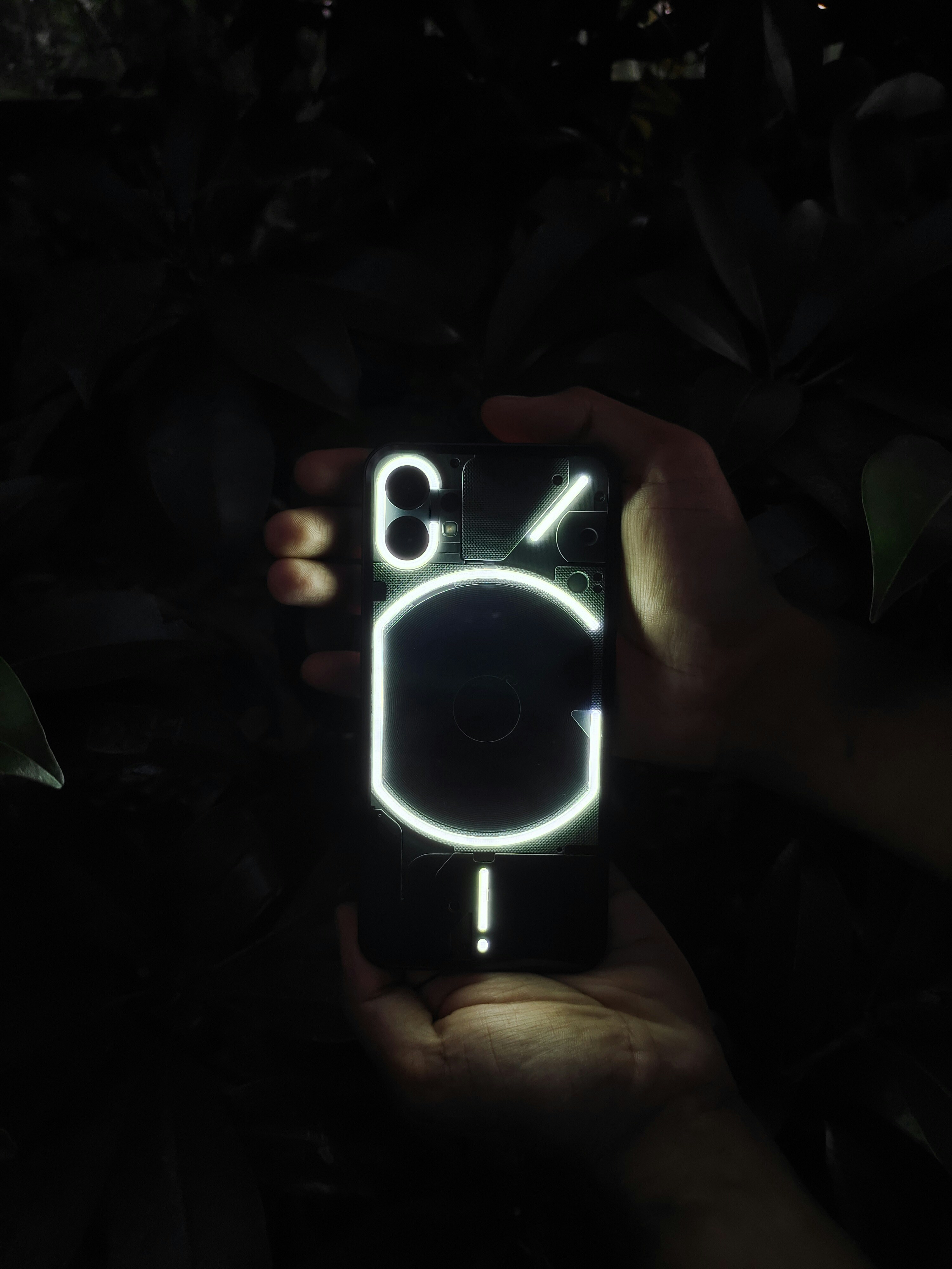 Nothing phone 1, glyph interface 🖤 | a person holding a cell phone