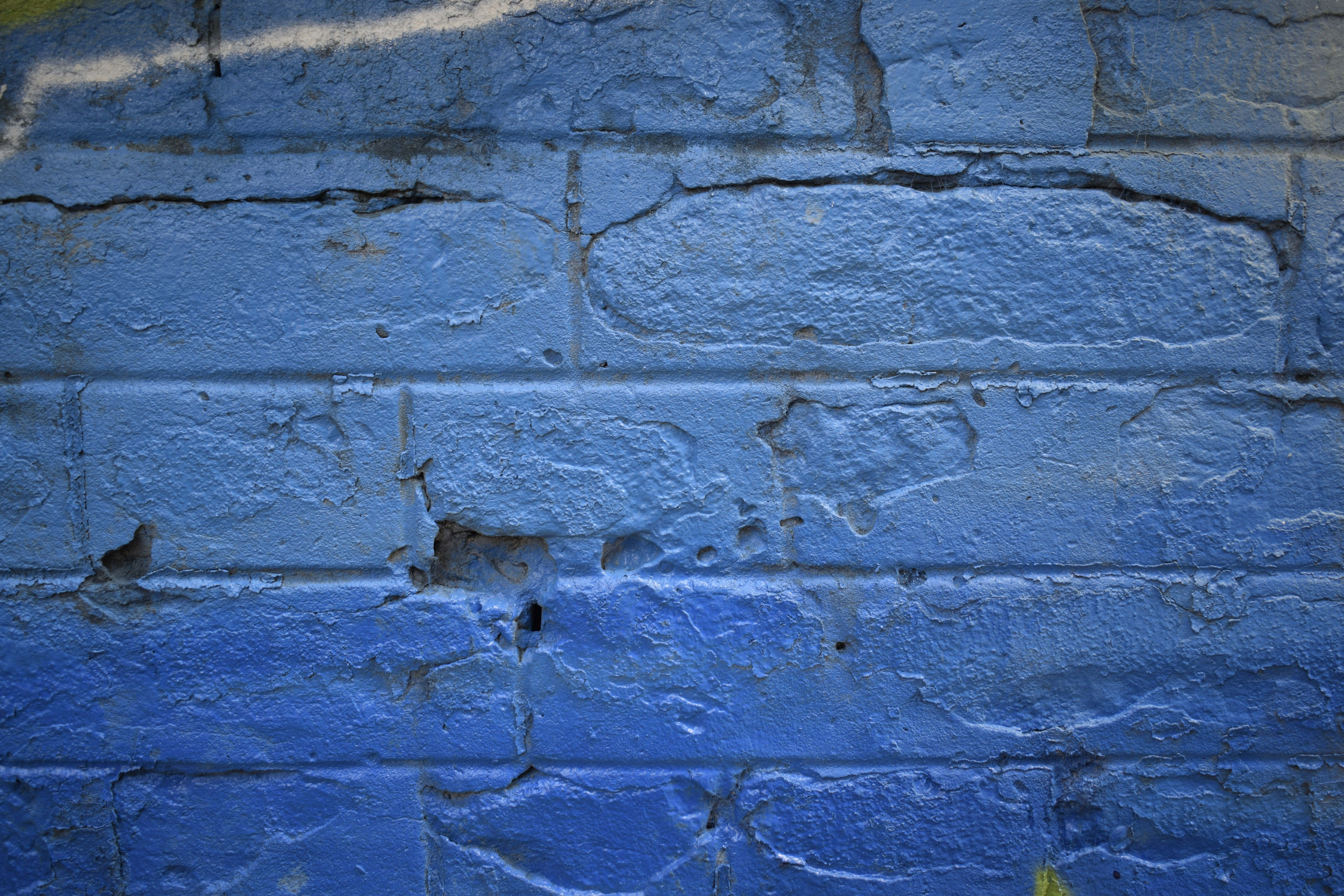 a close-up of a cracked brick wall