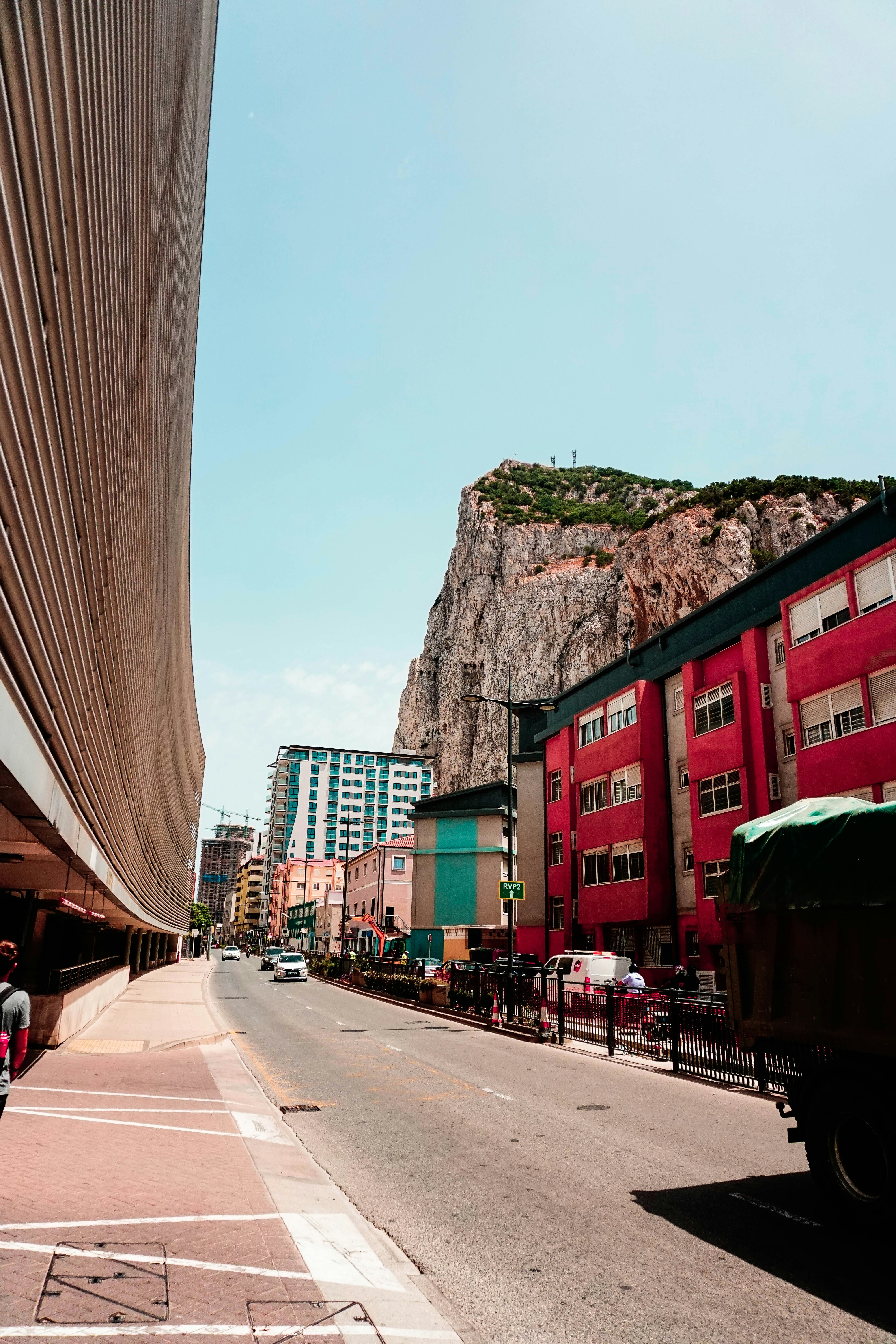 Ridge and Red Facades: A Street Carves Through an Urban Canyon