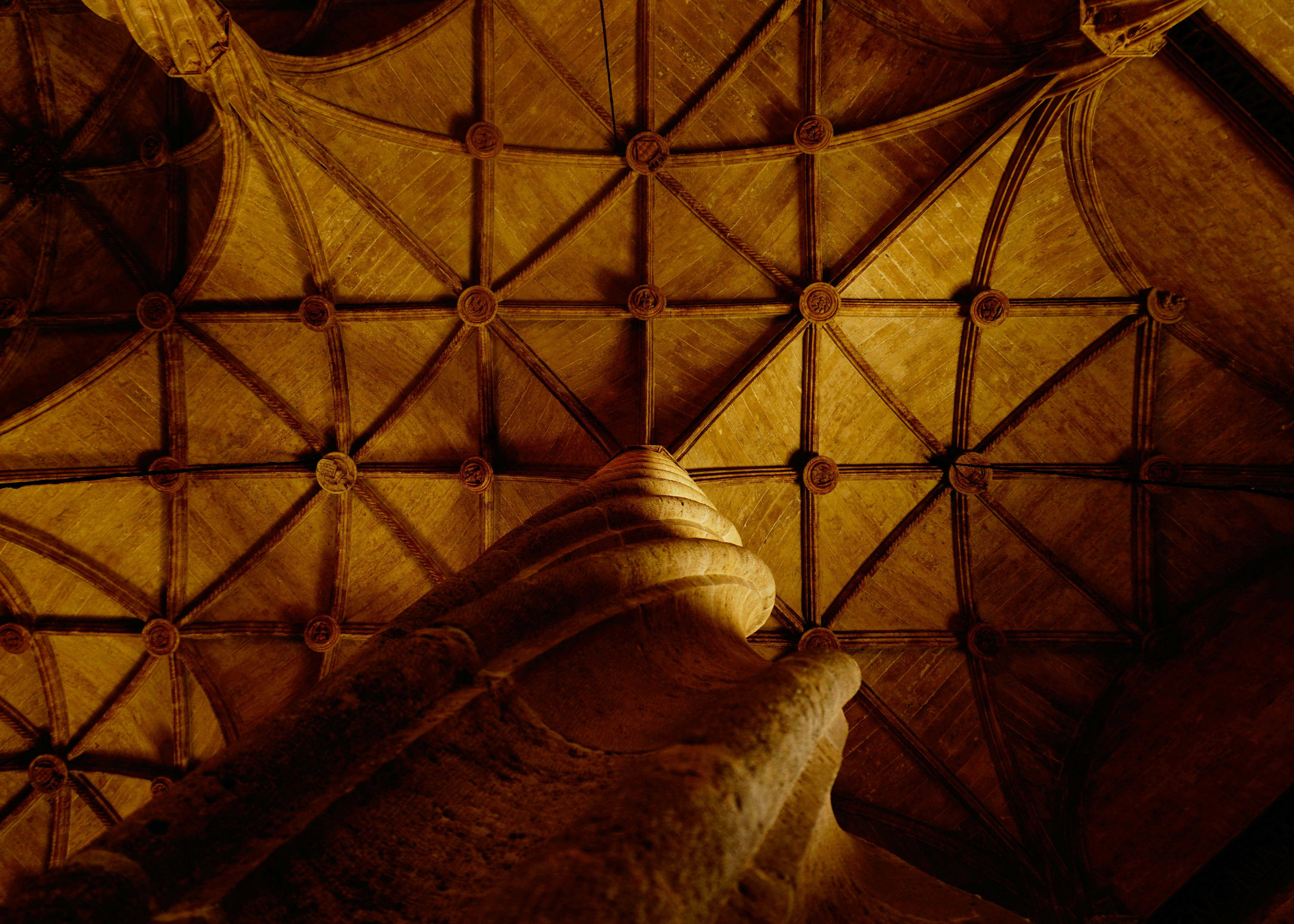 a yellow umbrella with many holes