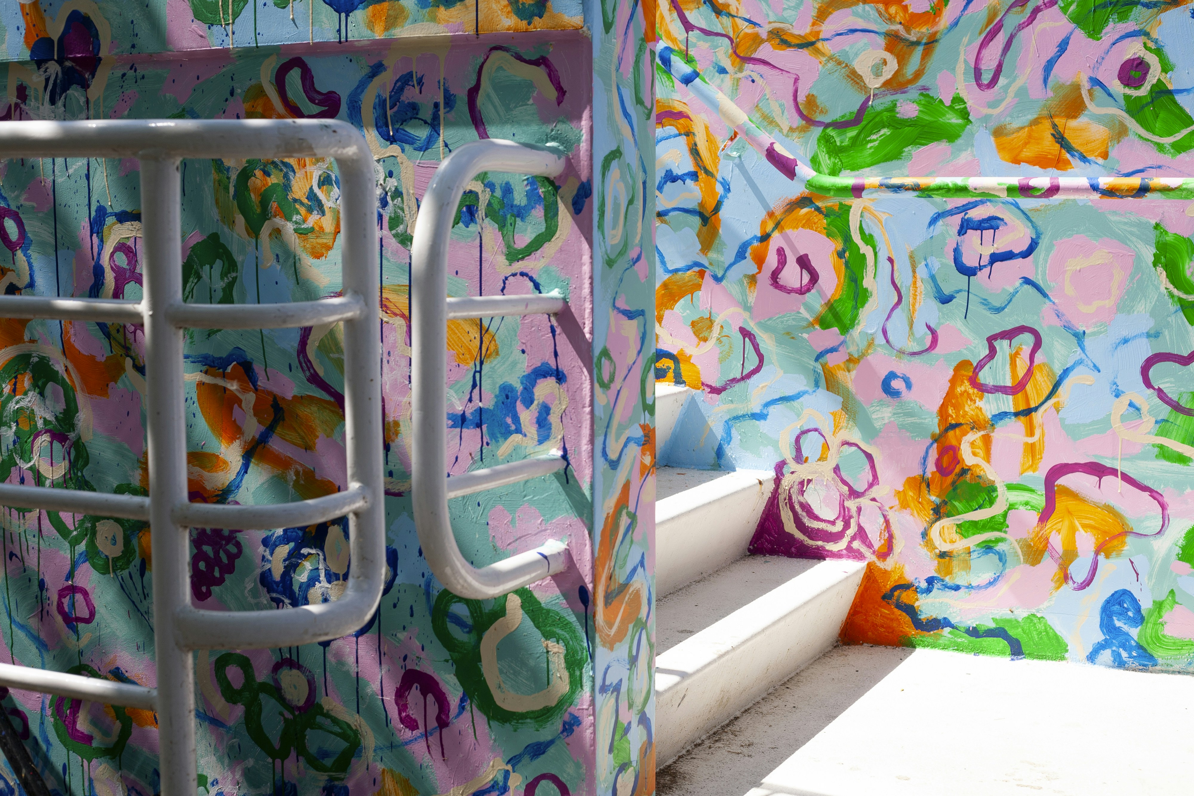 Neon Graffiti Stairwell: A Concrete Canvas Wrapped in Color