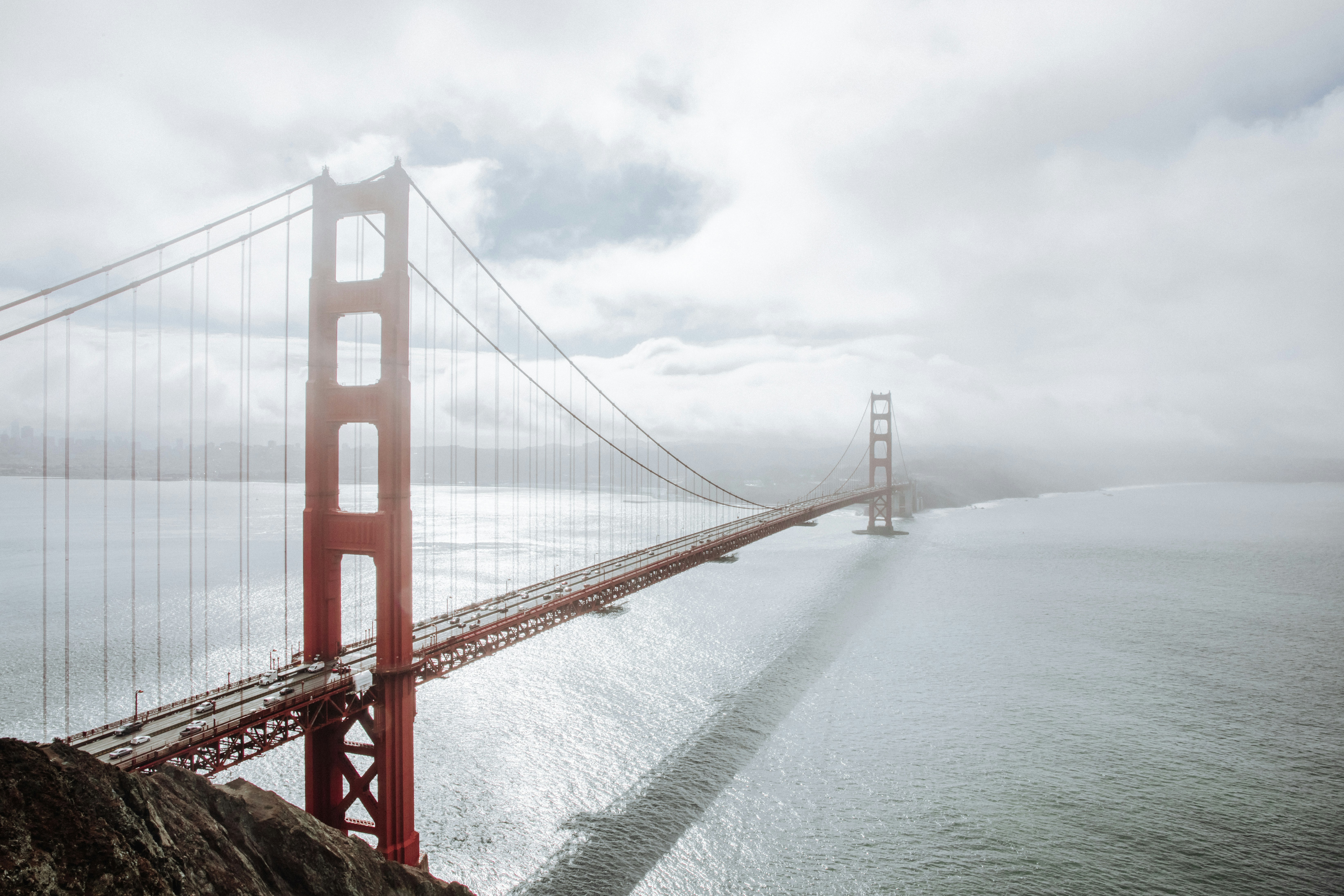 A large red bridge over water photo – Free San francisco Image on Unsplash