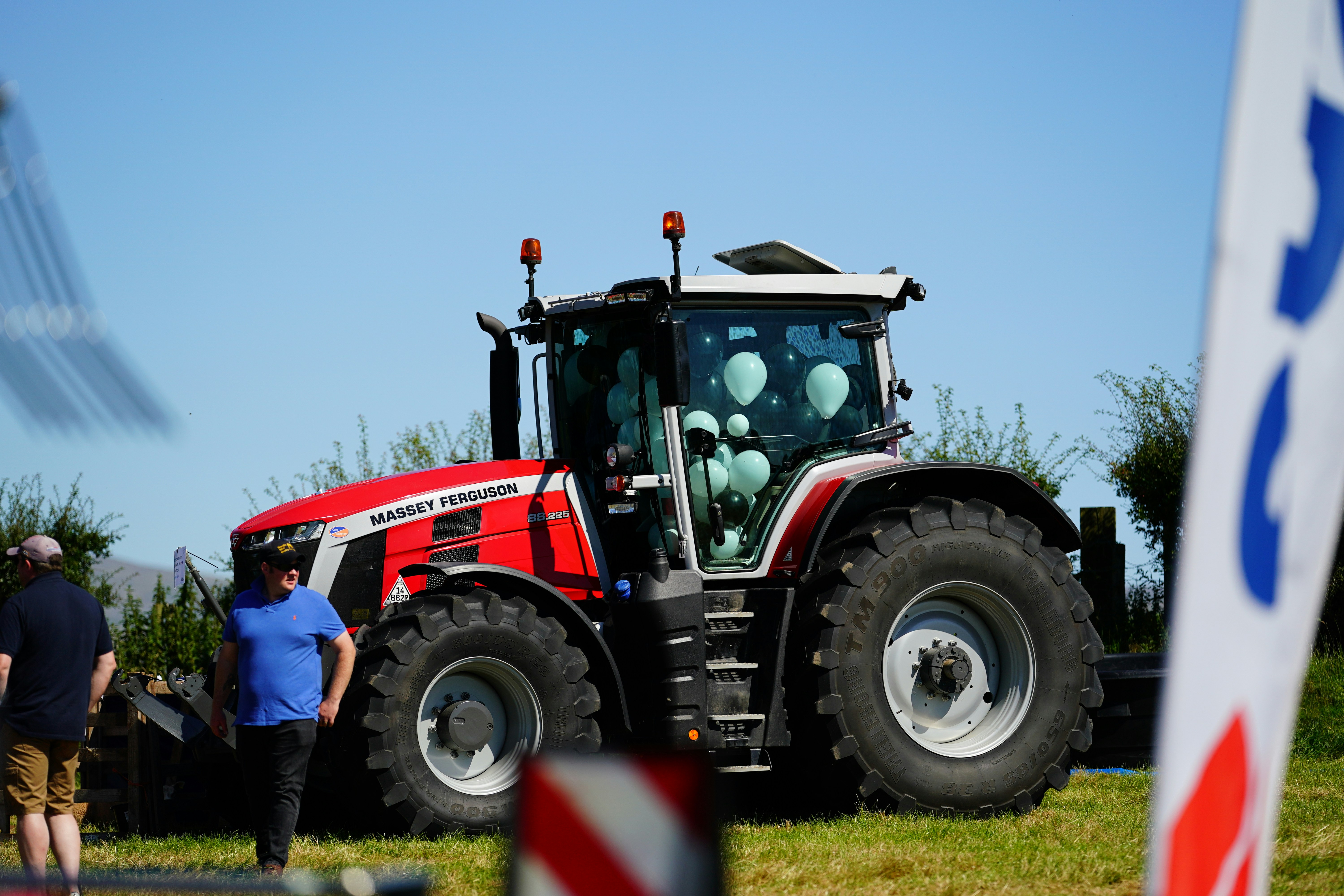 A tractor on a field photo – Free Human Image on Unsplash