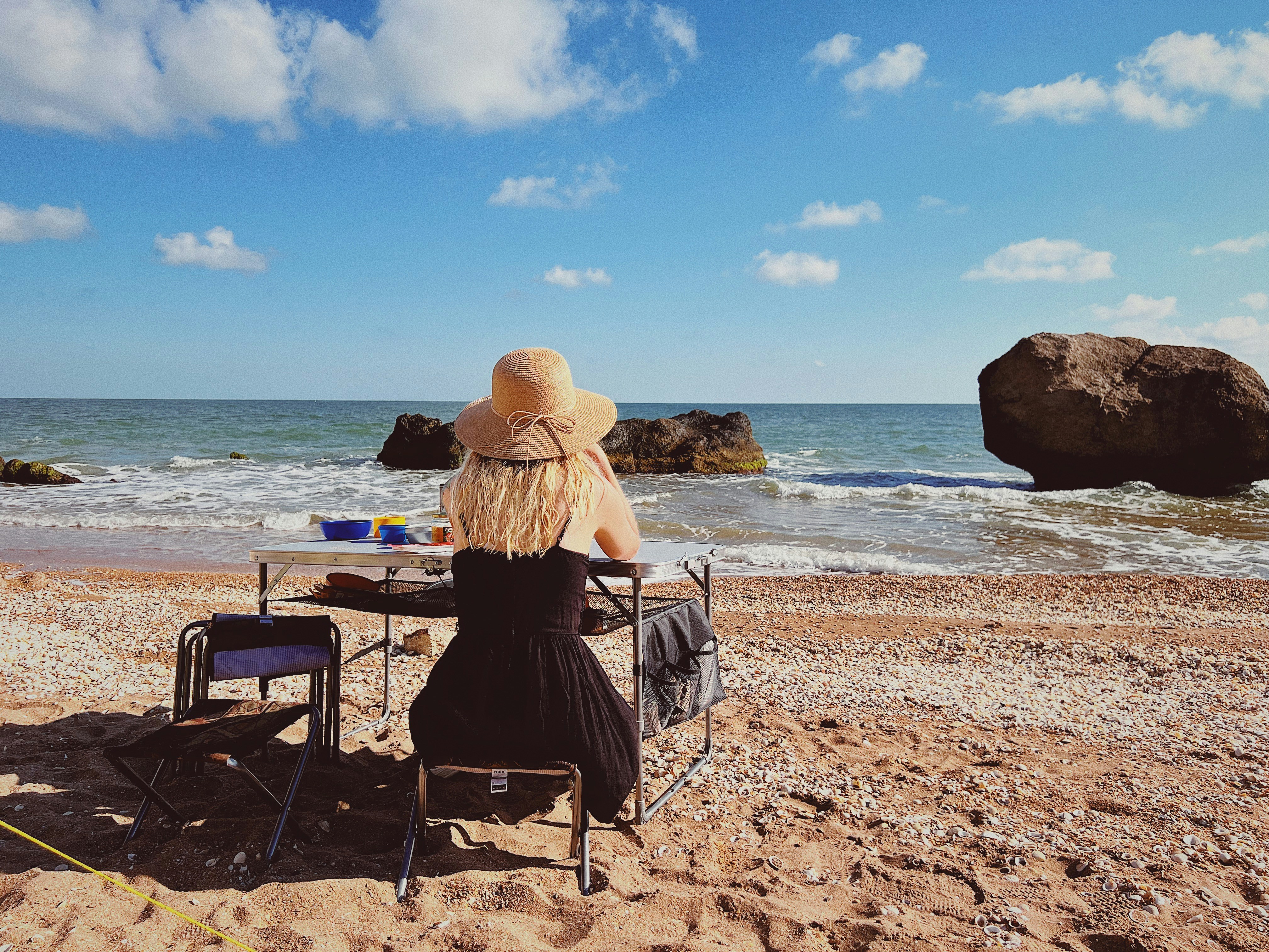 Sunlit Solace: A Quiet Beach Portrait at the Water's Edge