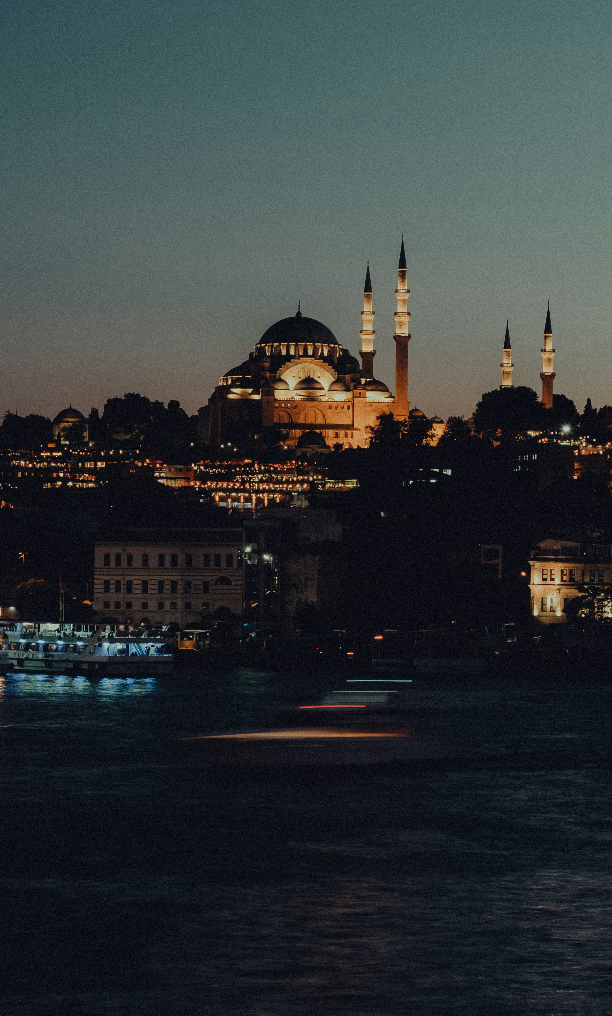 A city with a domed building and towers at night photo – Free Turkey ...