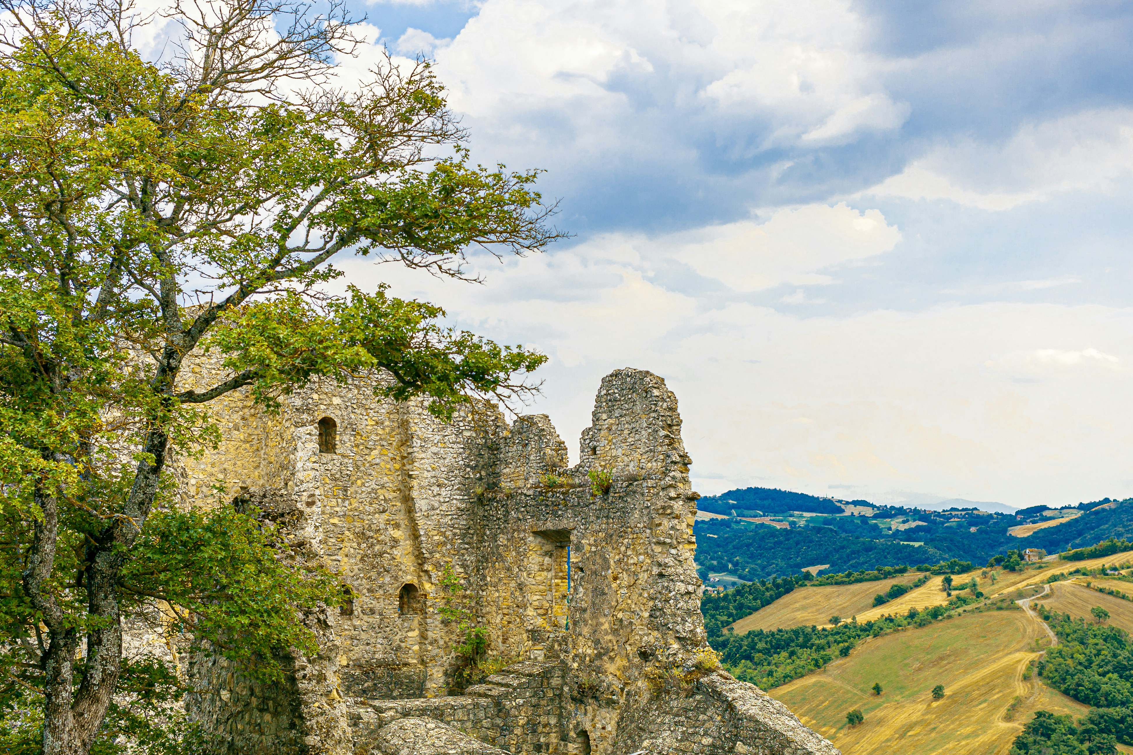 A stone building on a hill photo – Free Castello di canossa Image on ...