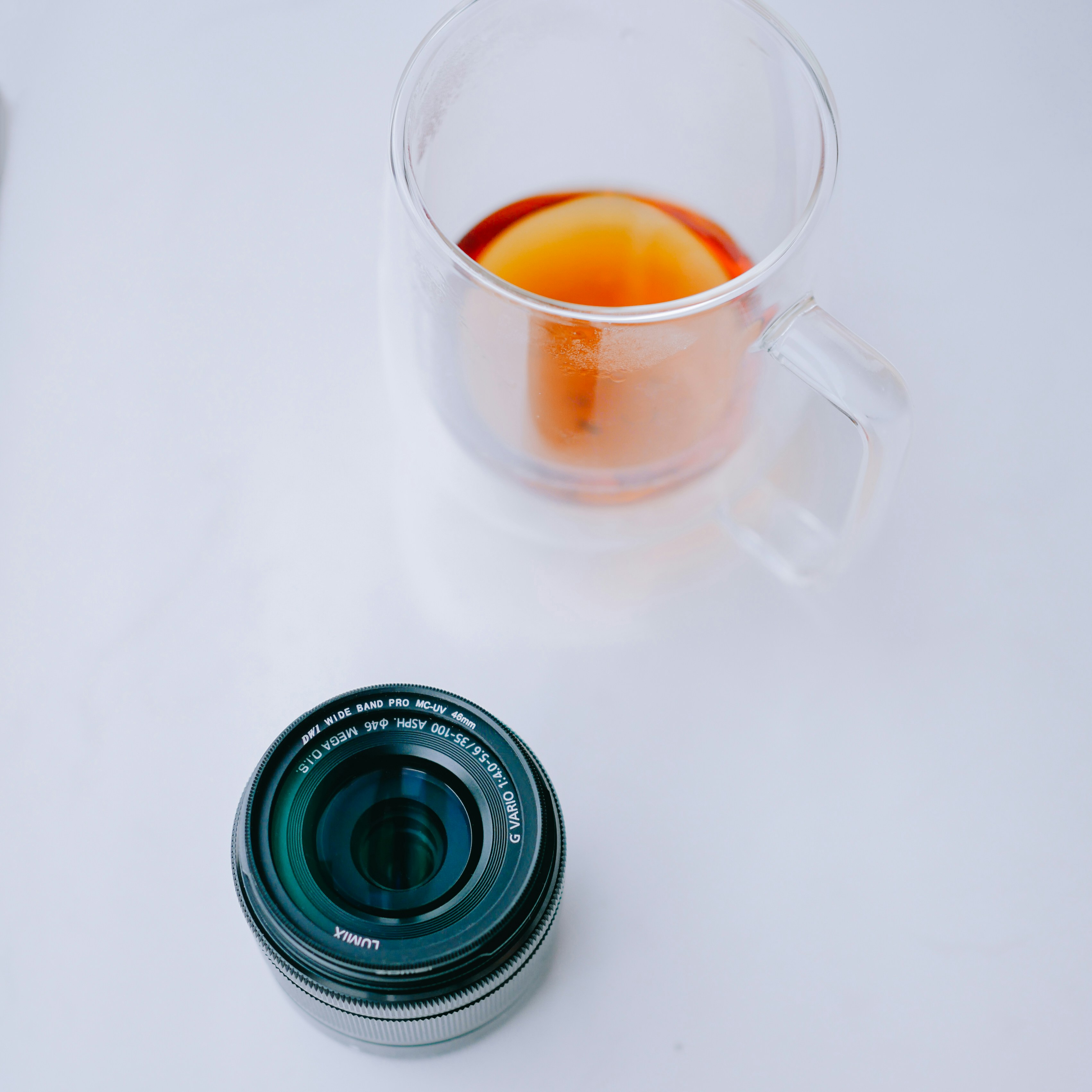 a glass of liquid and a camera