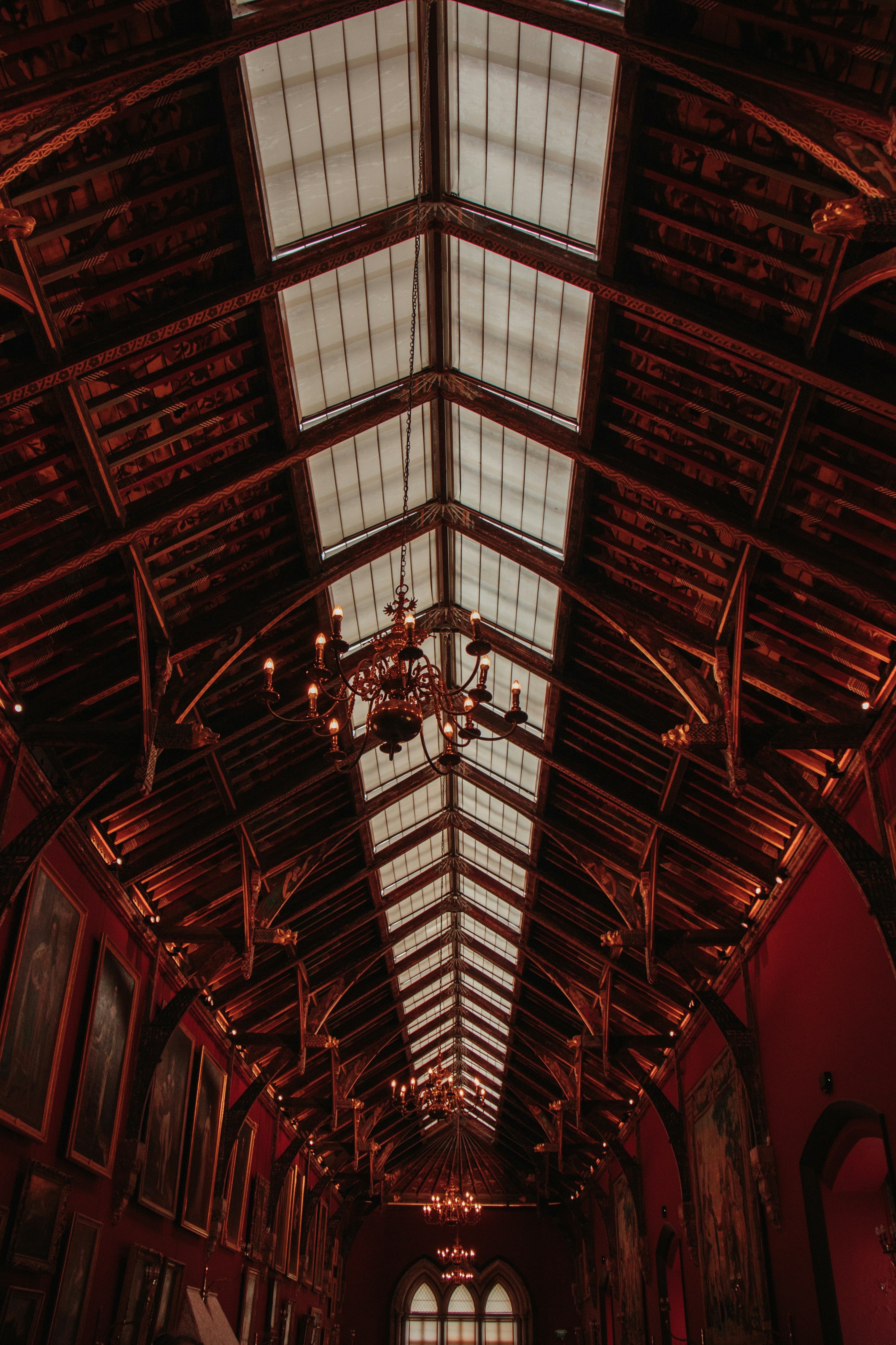 Crimson Vaults: A Long Corridor of Timber, Glass and Light