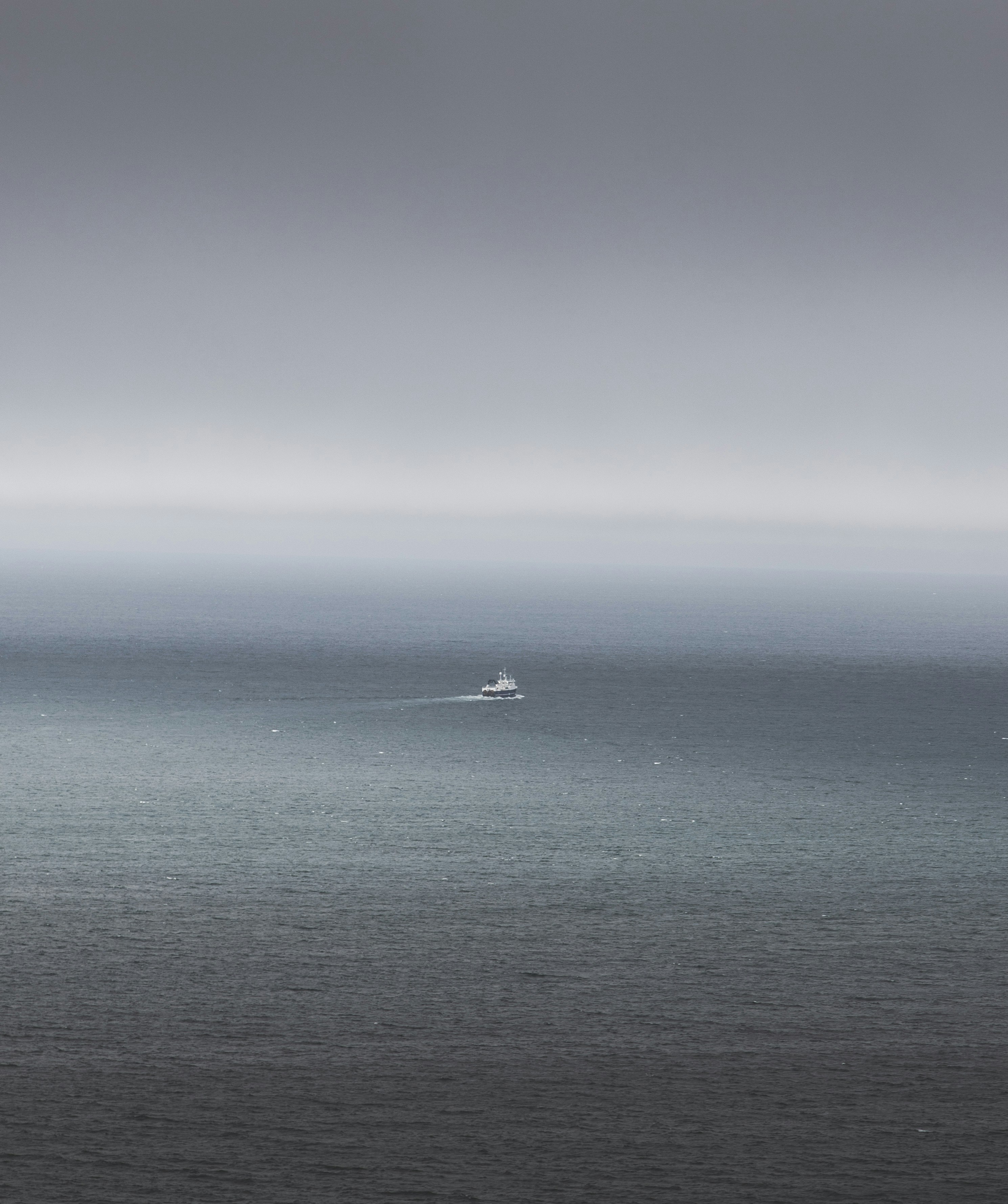 Distant Vessel Skimming a Velvet Horizon