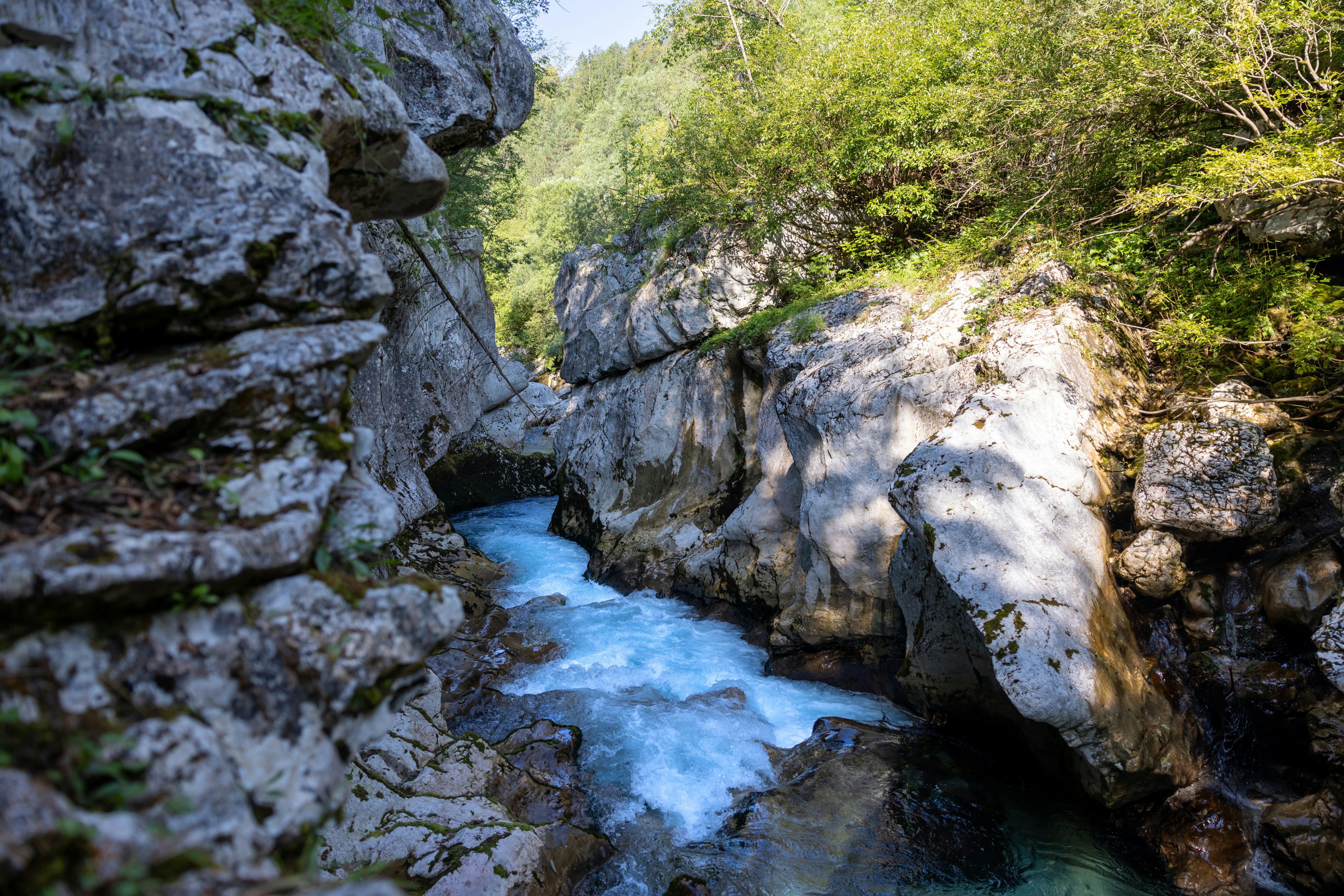 A stream of water between rocks photo – Free Slovenia Image on Unsplash