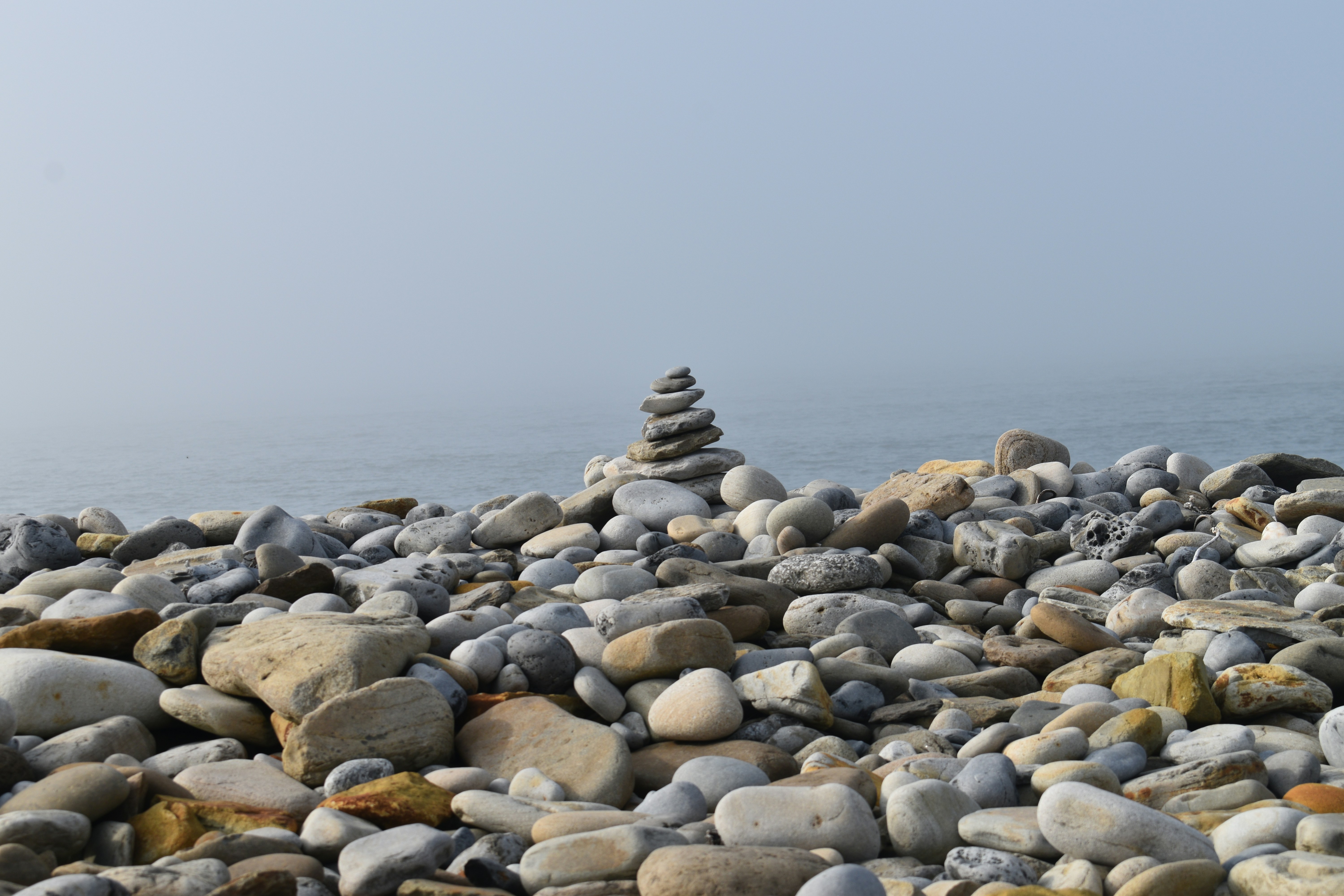 A large group of rocks on a beach photo – Free Grey Image on Unsplash