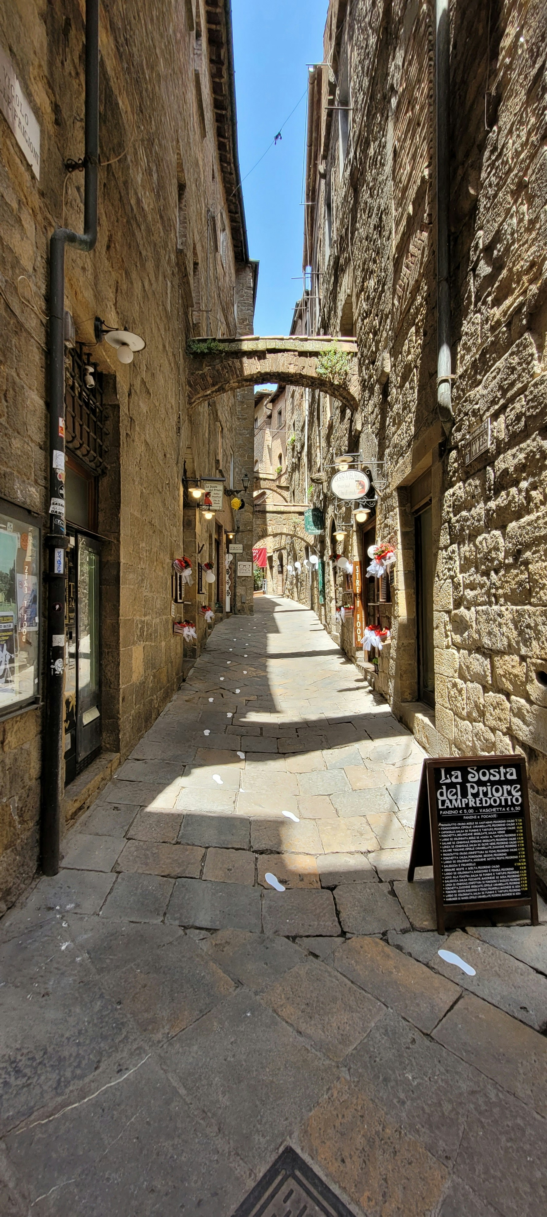 a narrow street with buildings on both sides