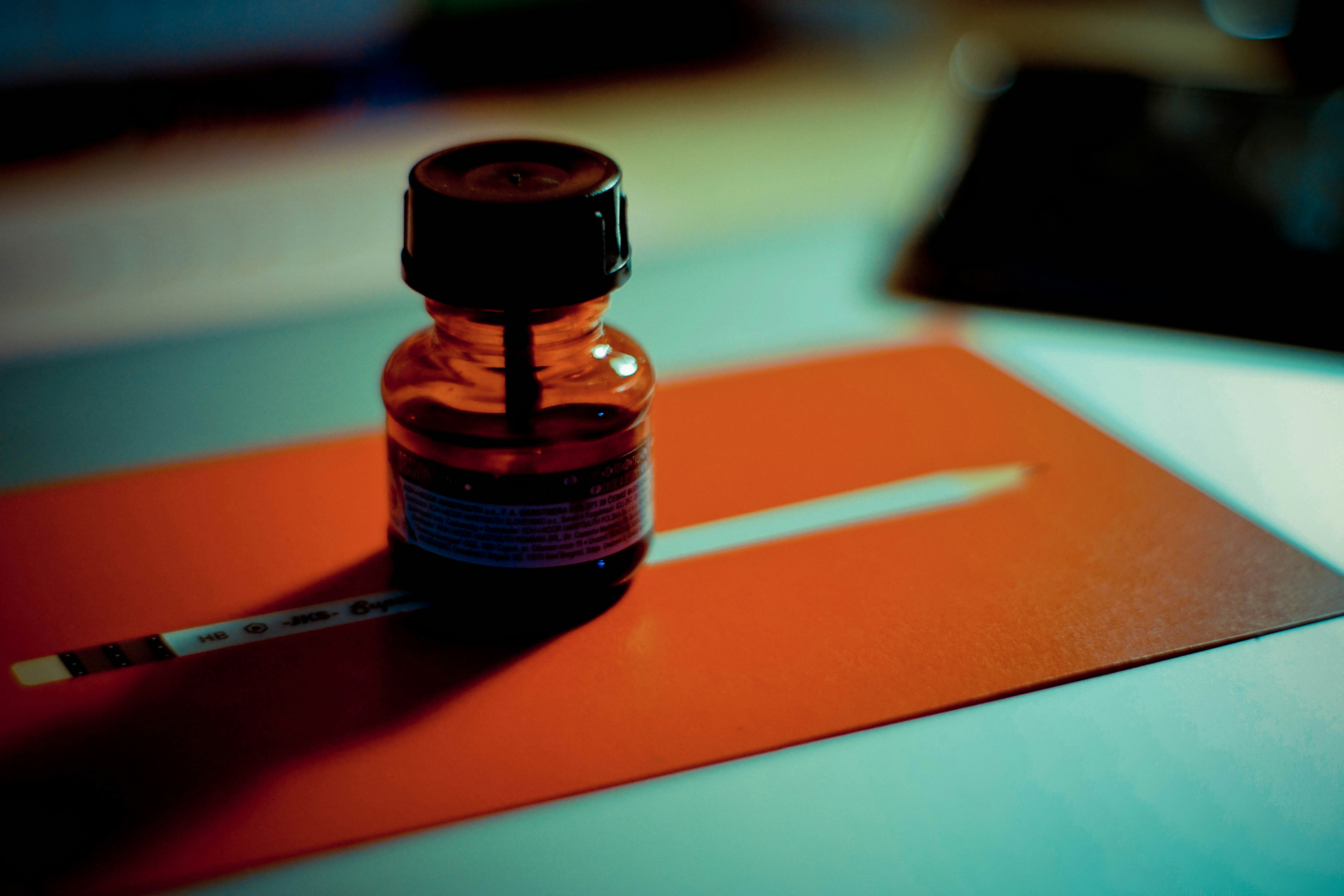 Amber Vial on a Tangerine Card: Quiet Focus, Bold Color