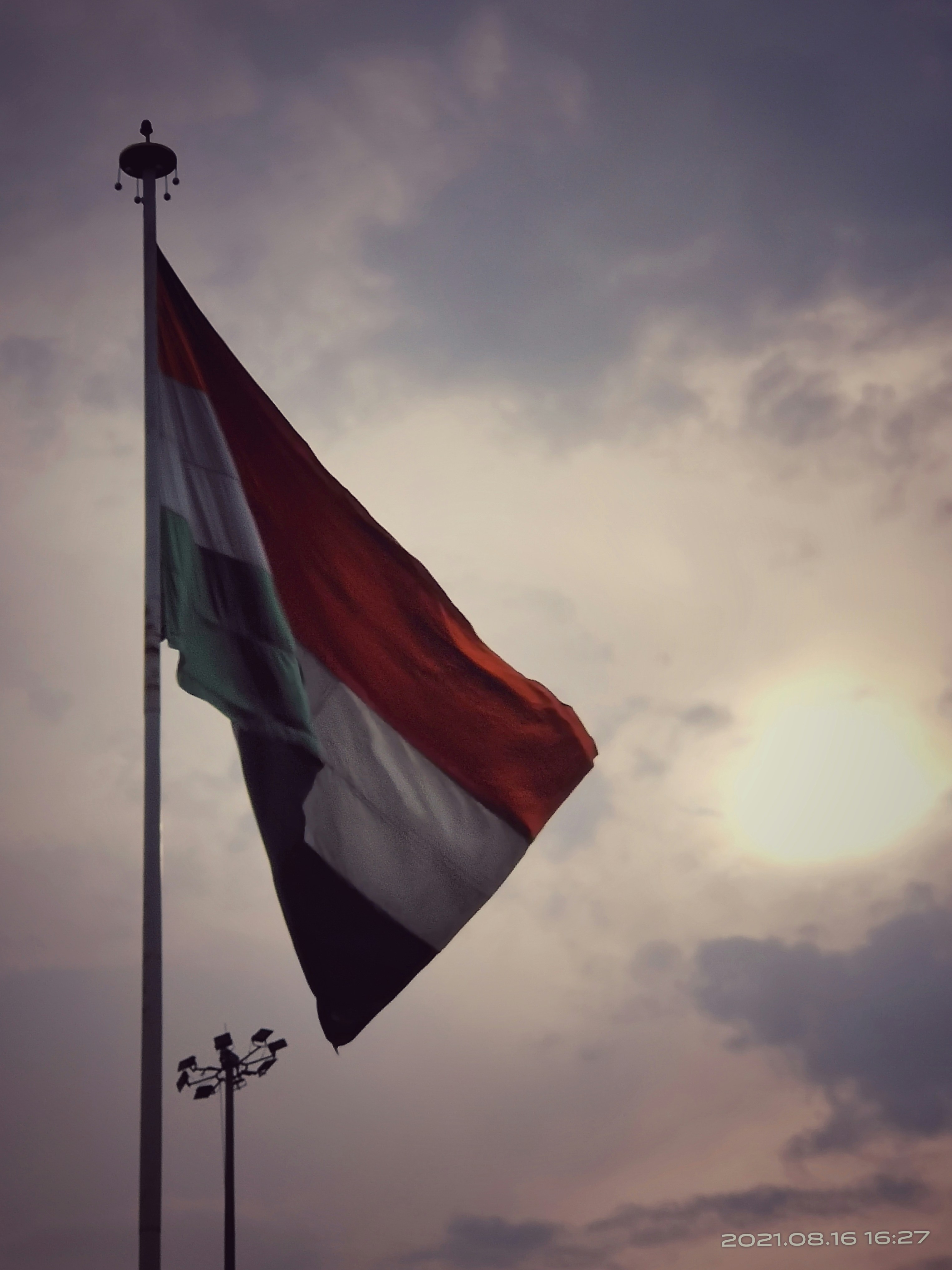 Wind-Carved Tri-Color Banner at Dusk