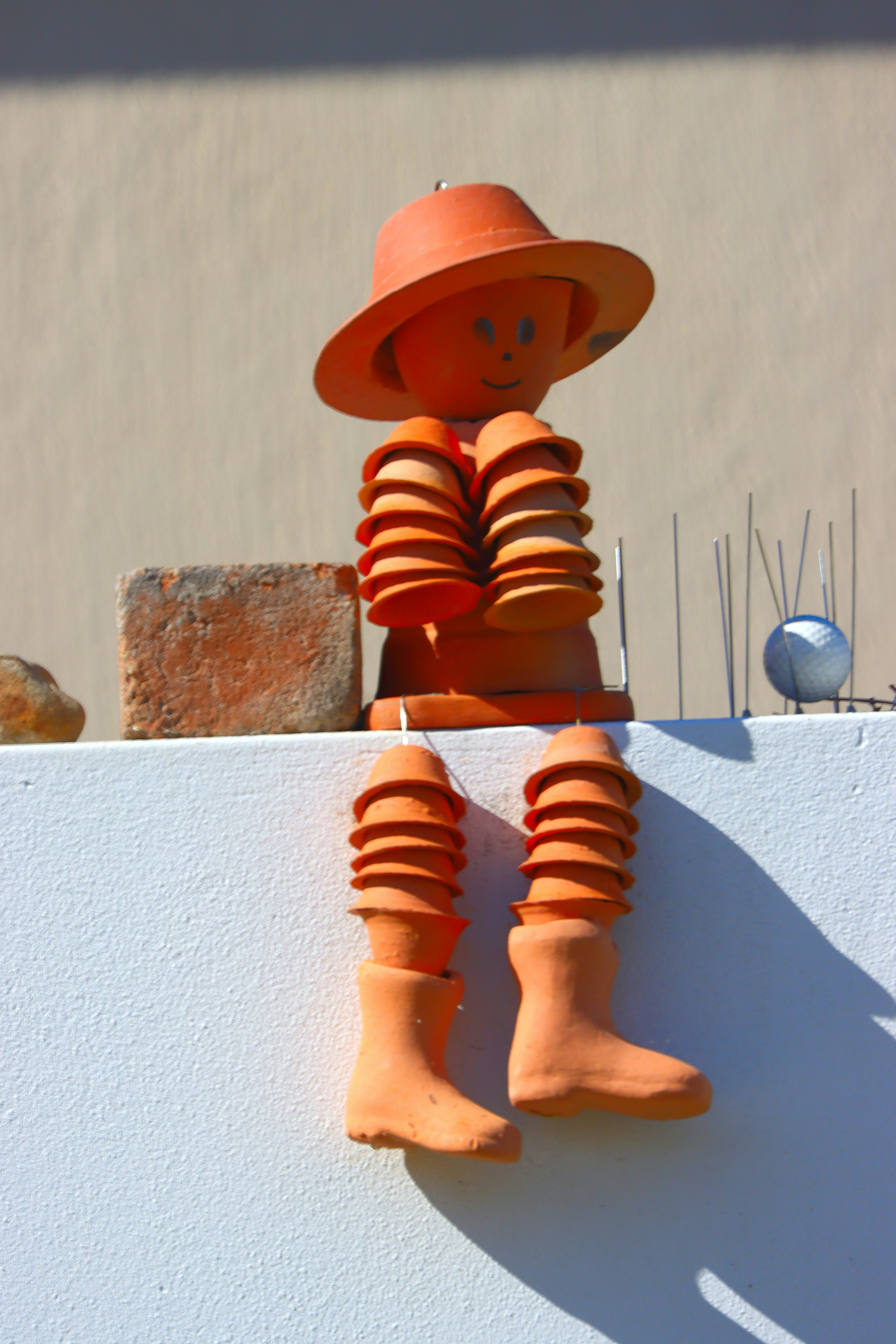 Whimsical Gardener: A Playful Clay Figure