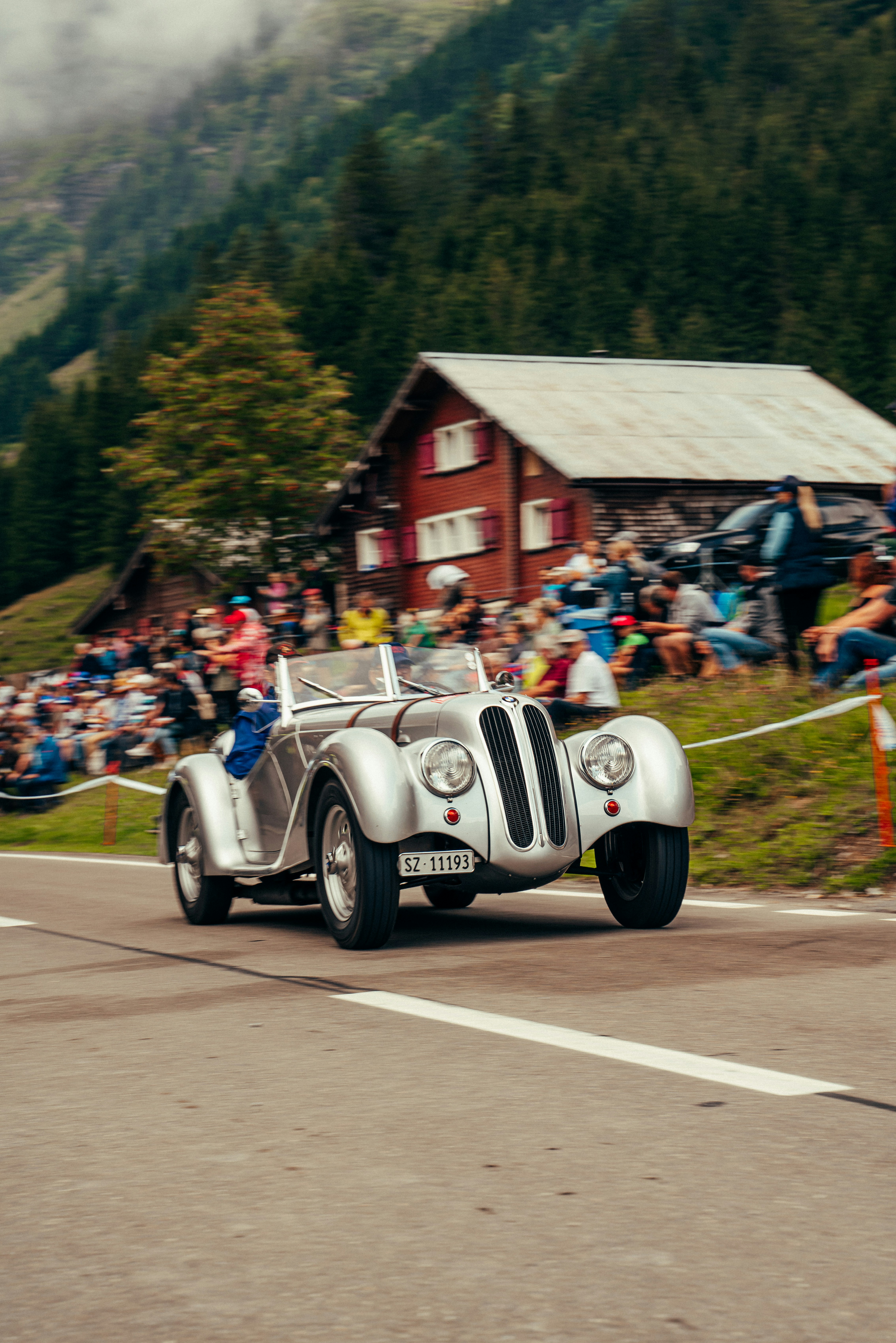 Vintage Open-Top Silver Dawn: A Classic Car Races Along a Mountain Road